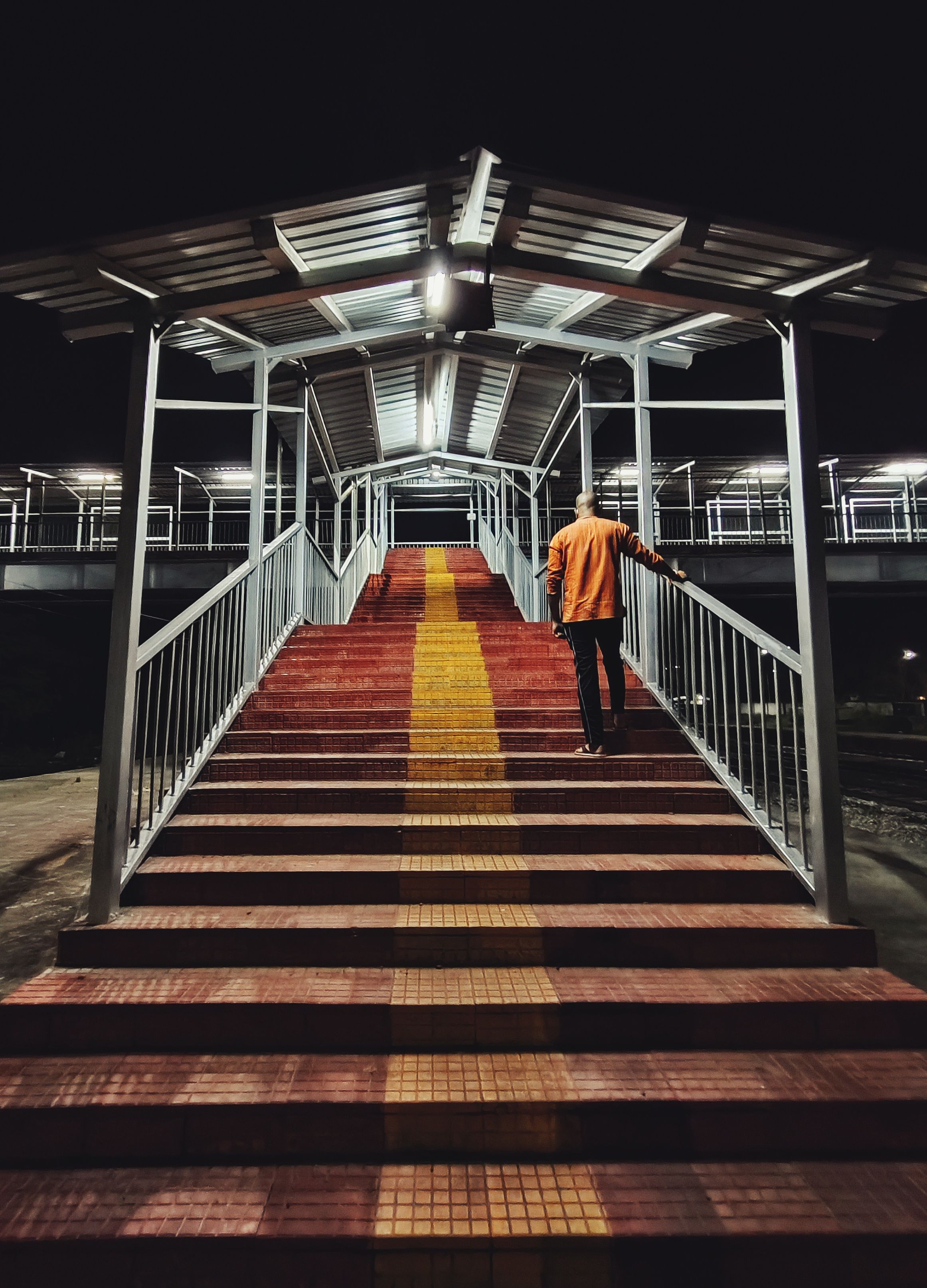 Man Walking on Stairs at Night · Free Stock Photo