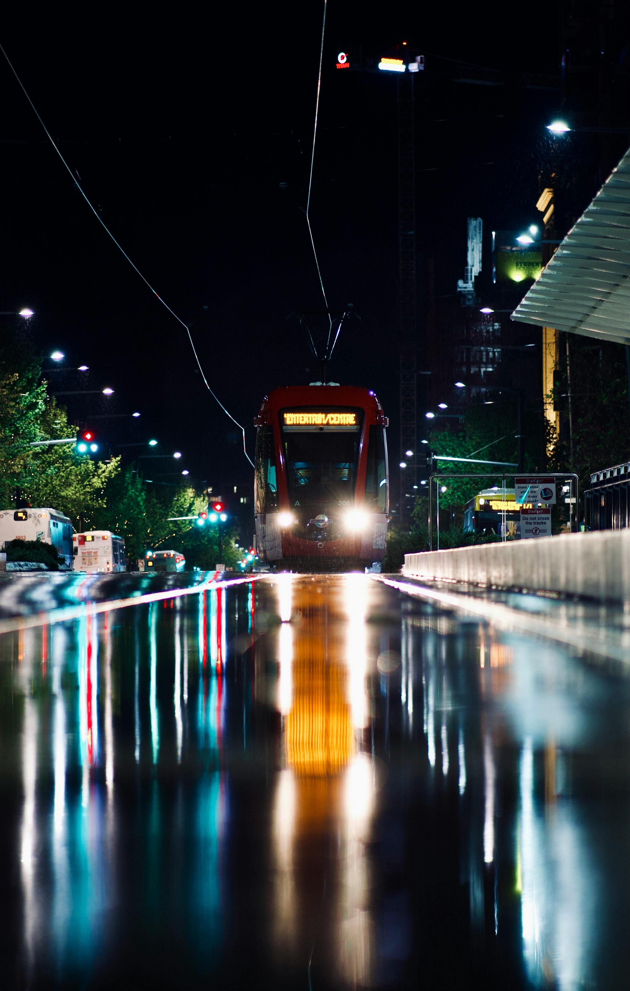 Red and Black Train on Rail during Night Time · Free Stock Photo