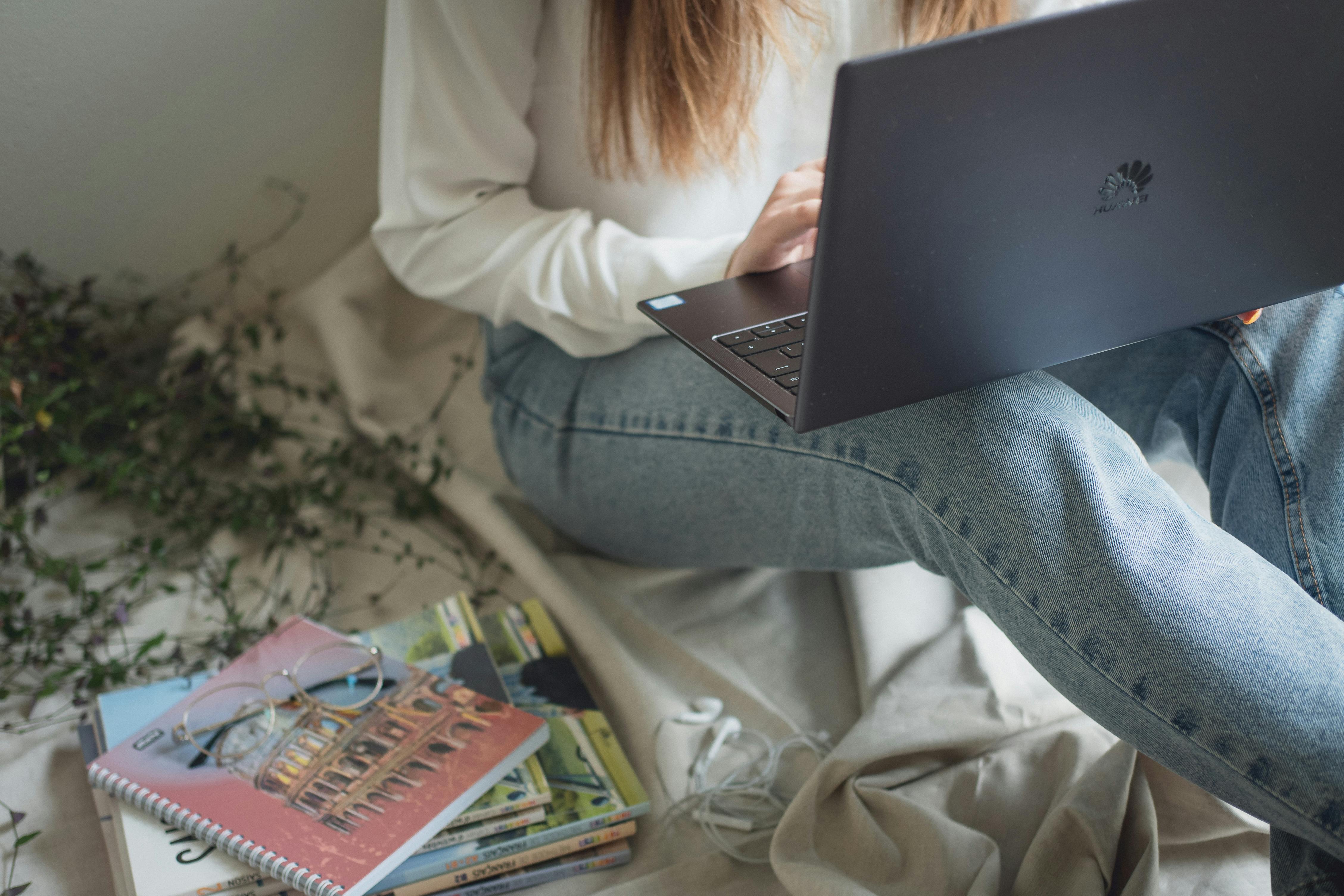 Calm lady studying with laptop and books · Free Stock Photo