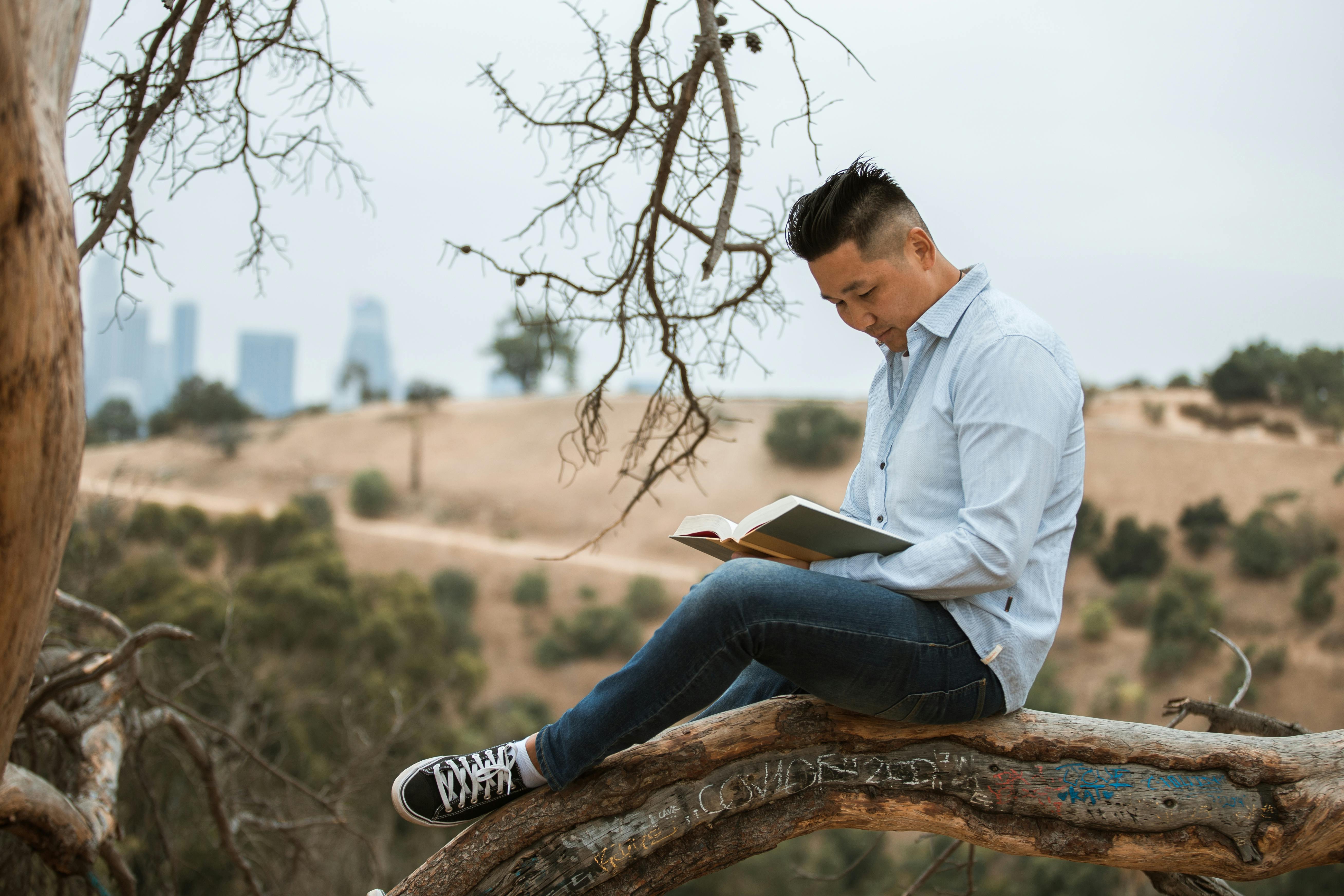 A Man Reading a Book · Free Stock Photo