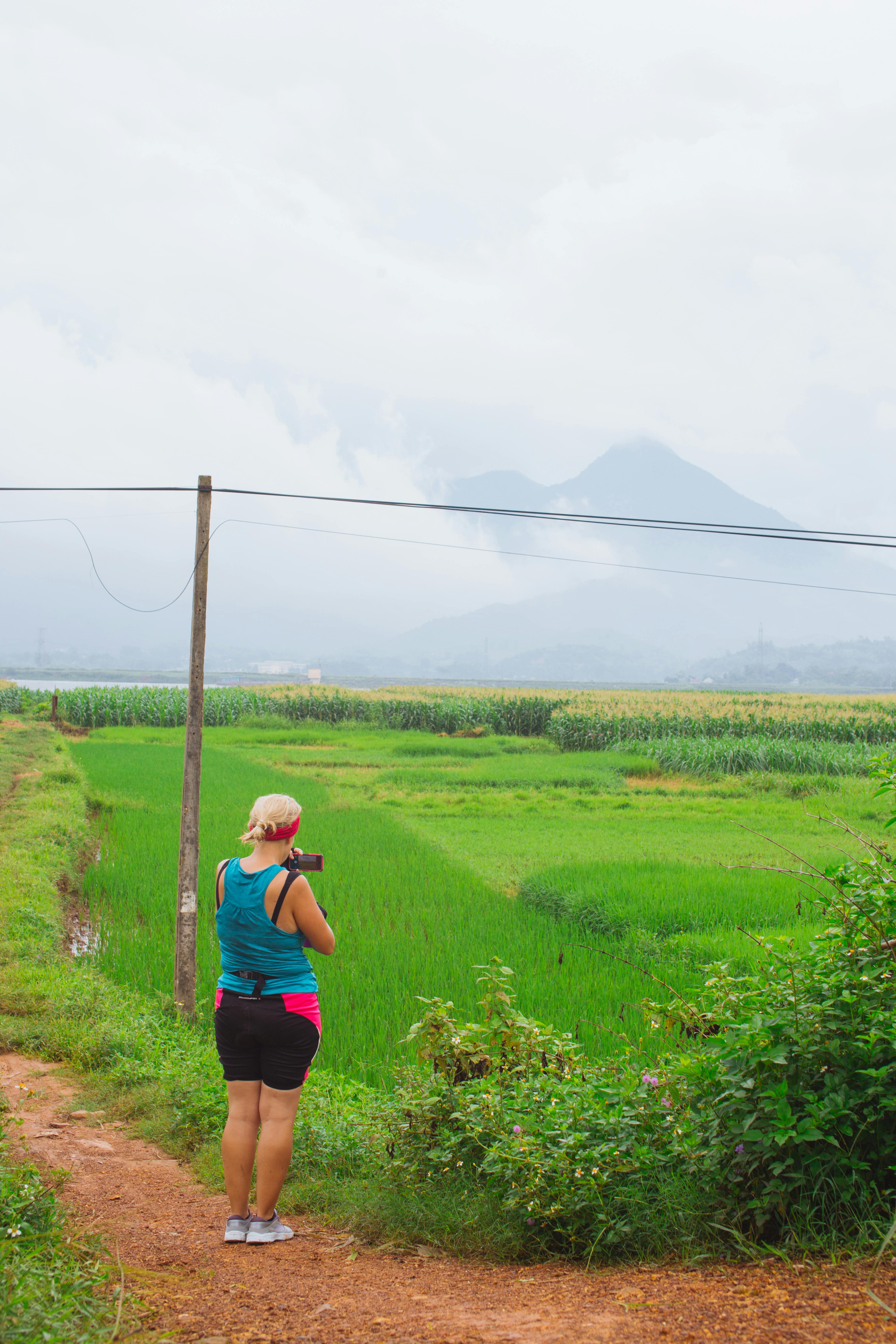 Woman Photographing a Landscape · Free Stock Photo