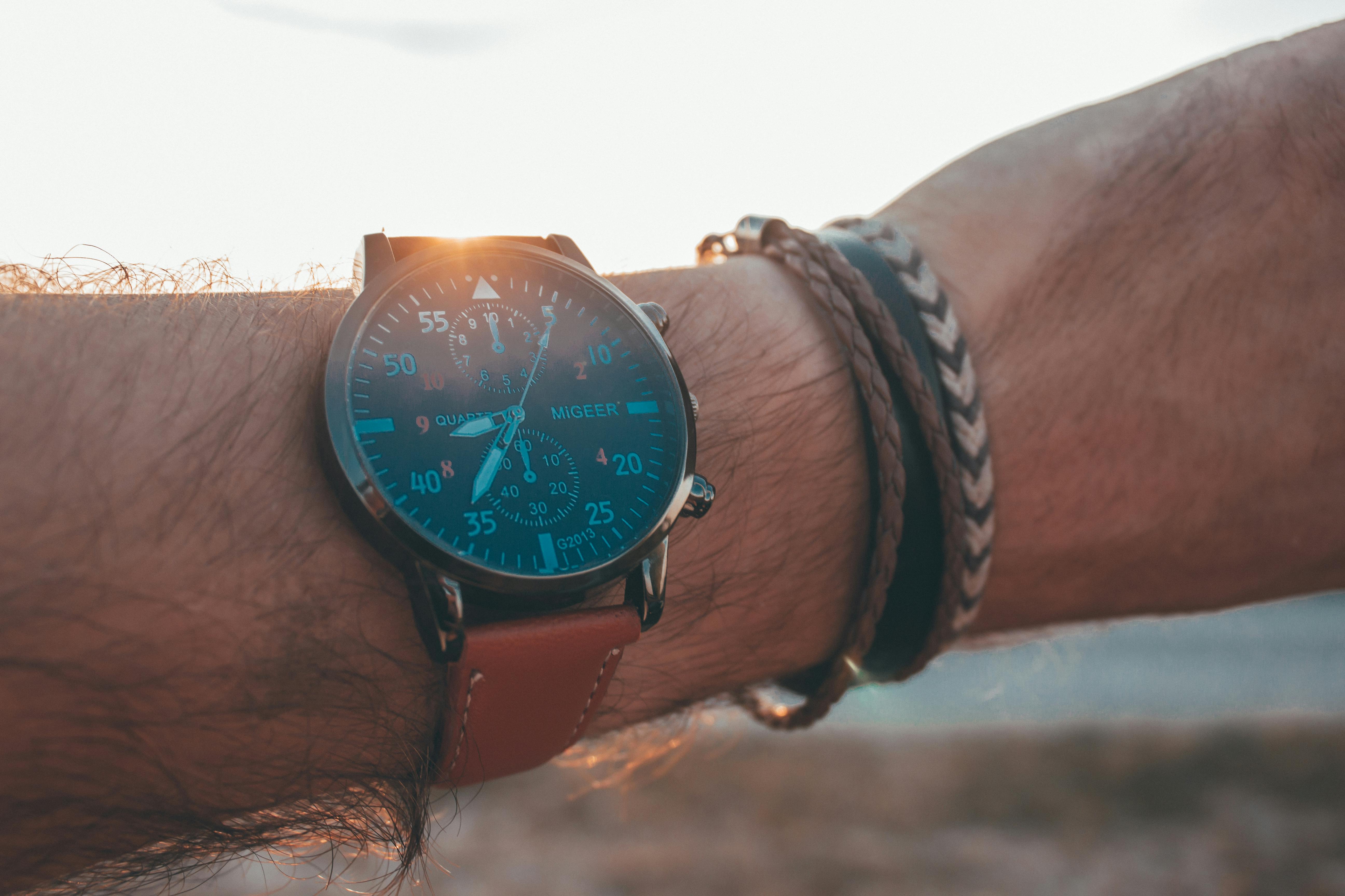 Wrist of a Person Wearing Watch and Bracelets · Free Stock Photo
