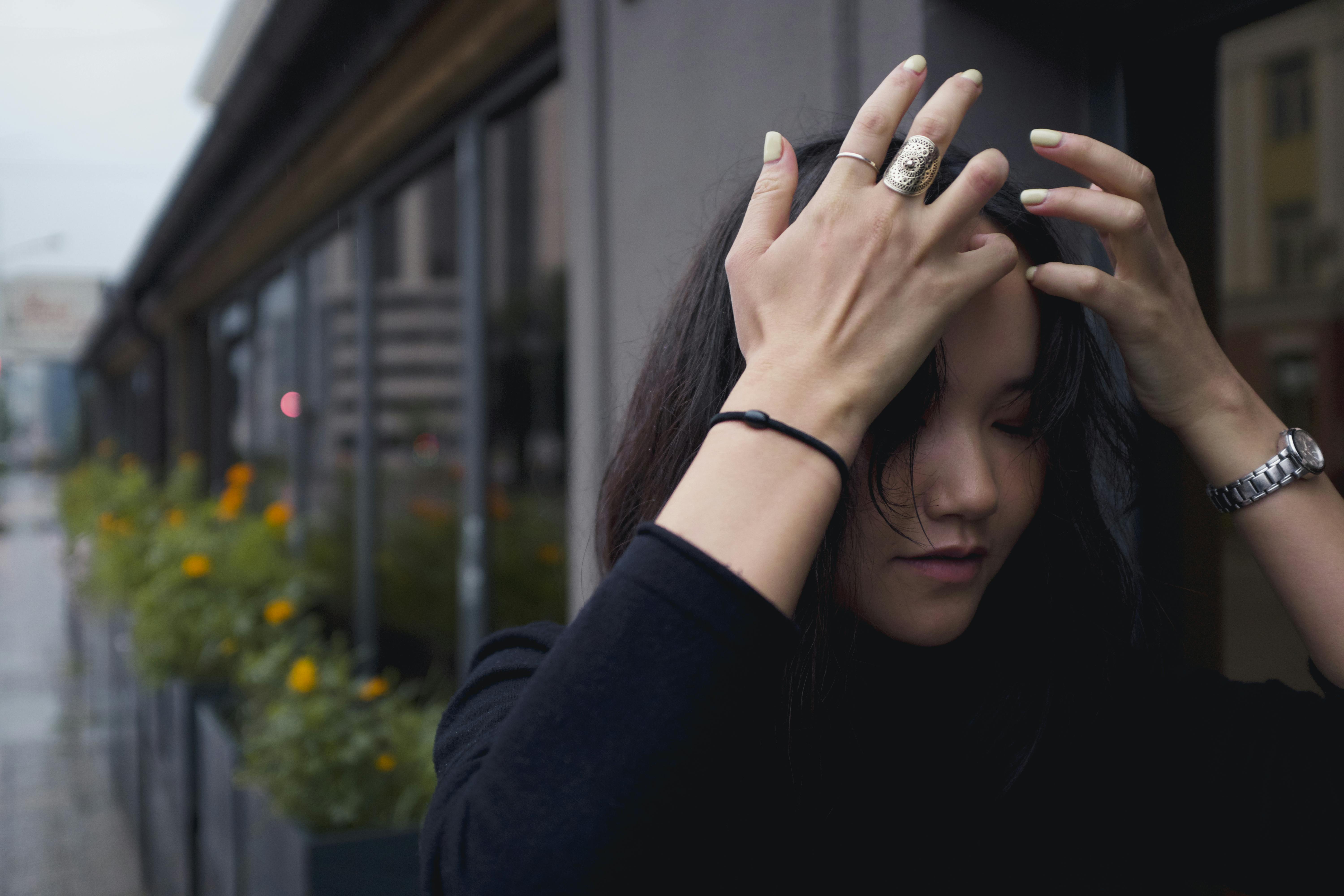 Woman with Hands on Hair · Free Stock Photo