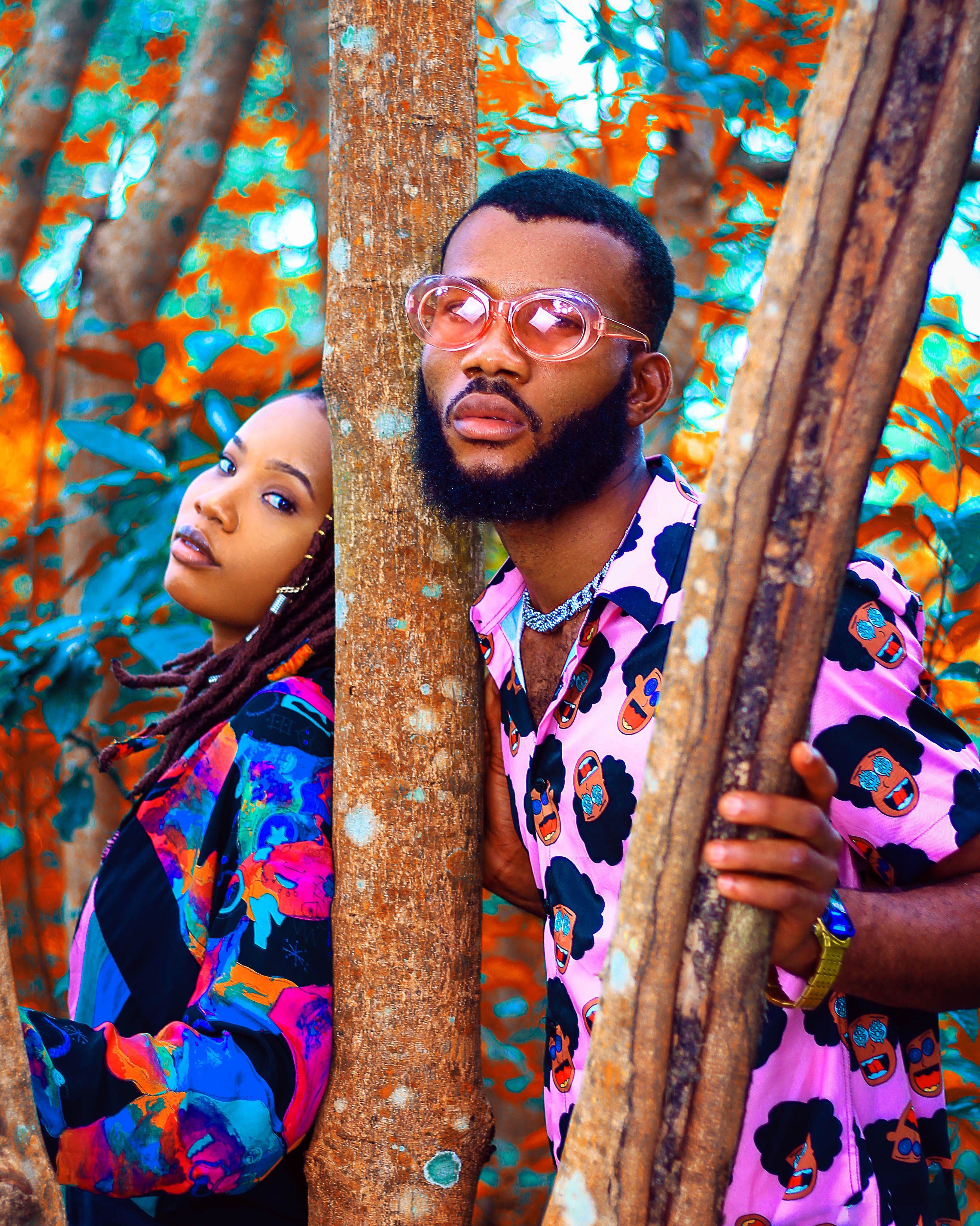 Serious African couple standing in park · Free Stock Photo