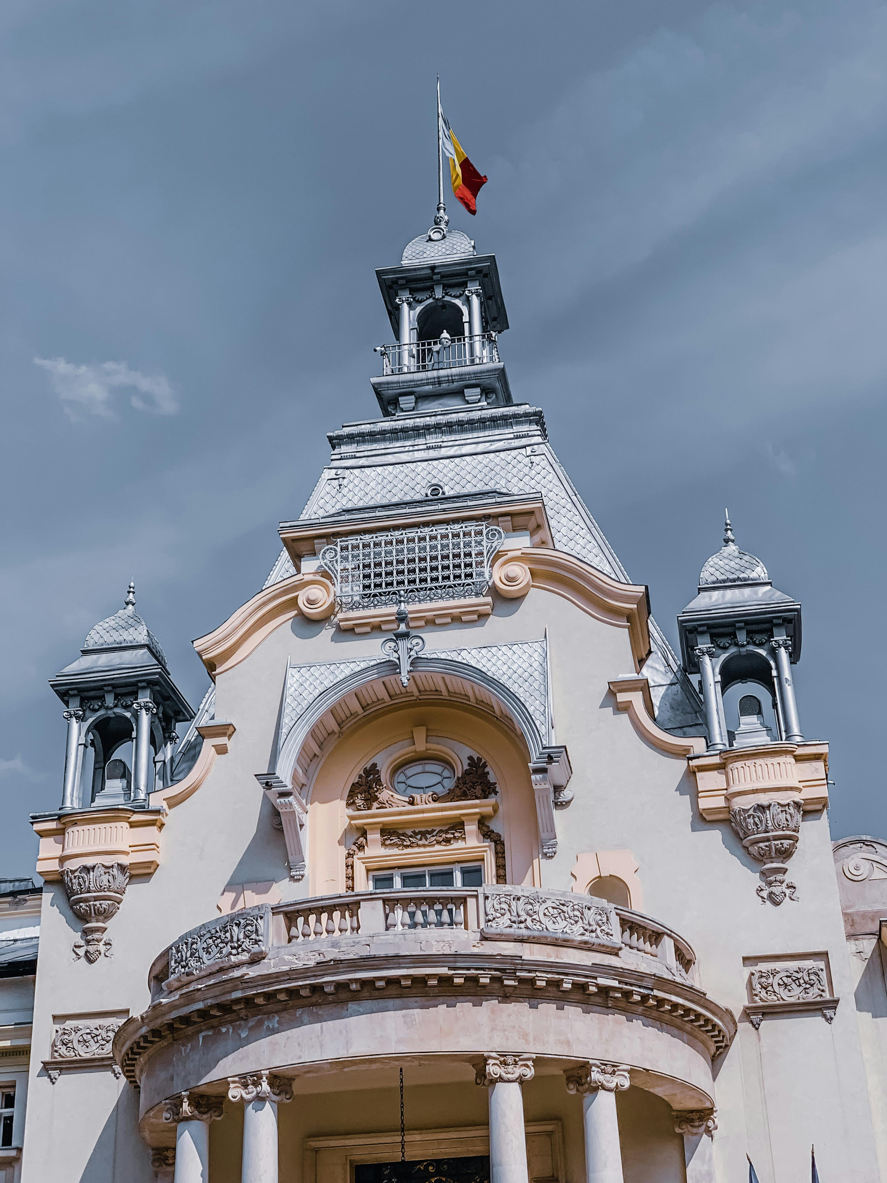 Majestic bright building with balcony and decorations · Free Stock Photo