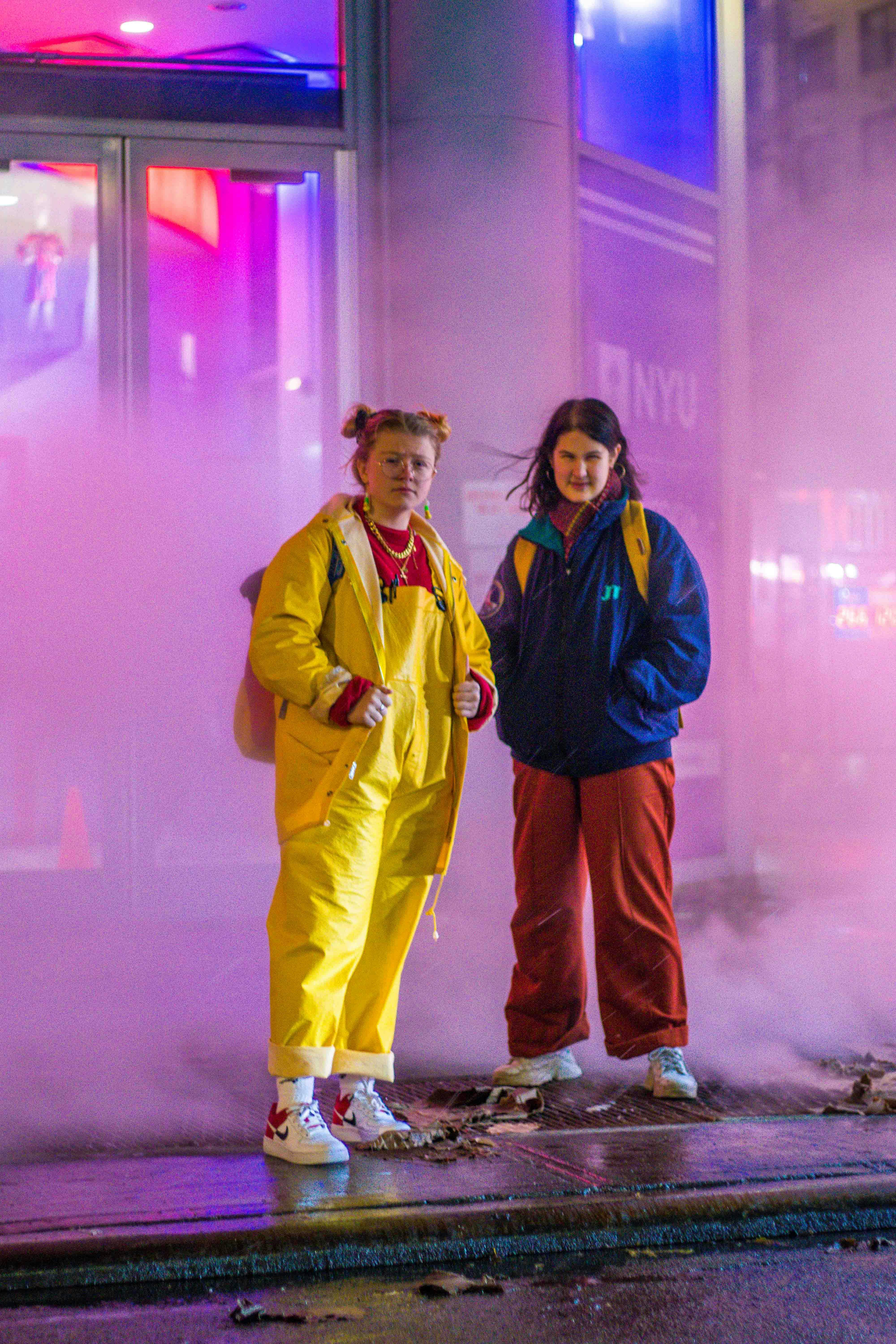 Woman Standing under Light on Porch at Night · Free Stock Photo