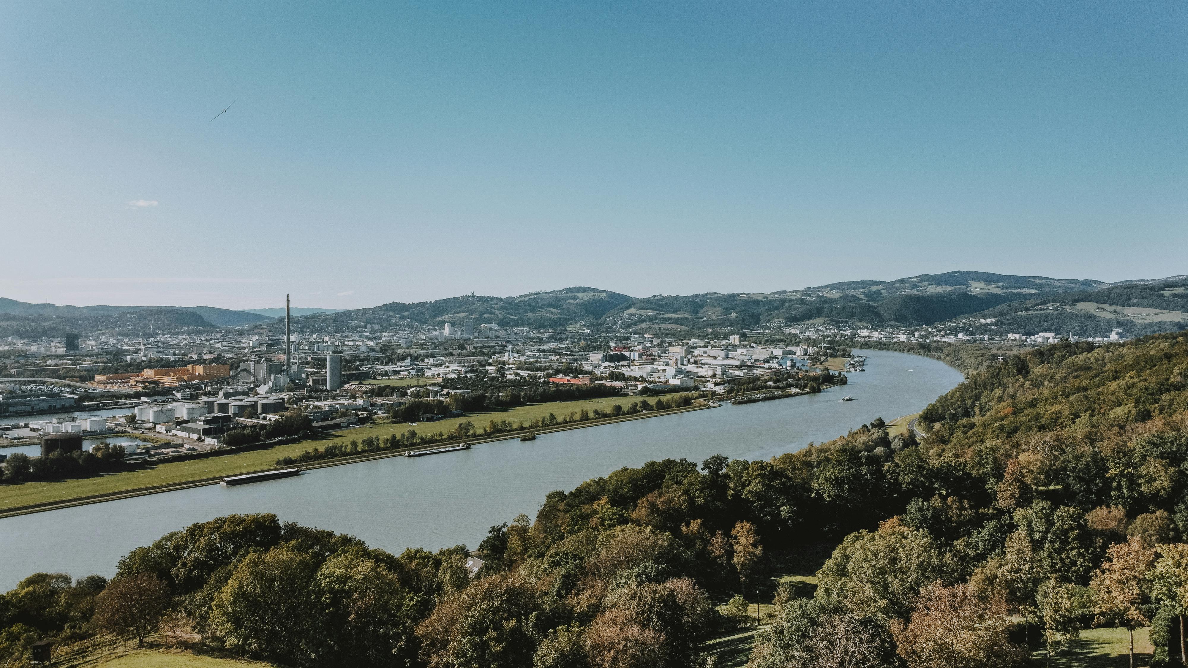 Modern building located on riverbank · Free Stock Photo