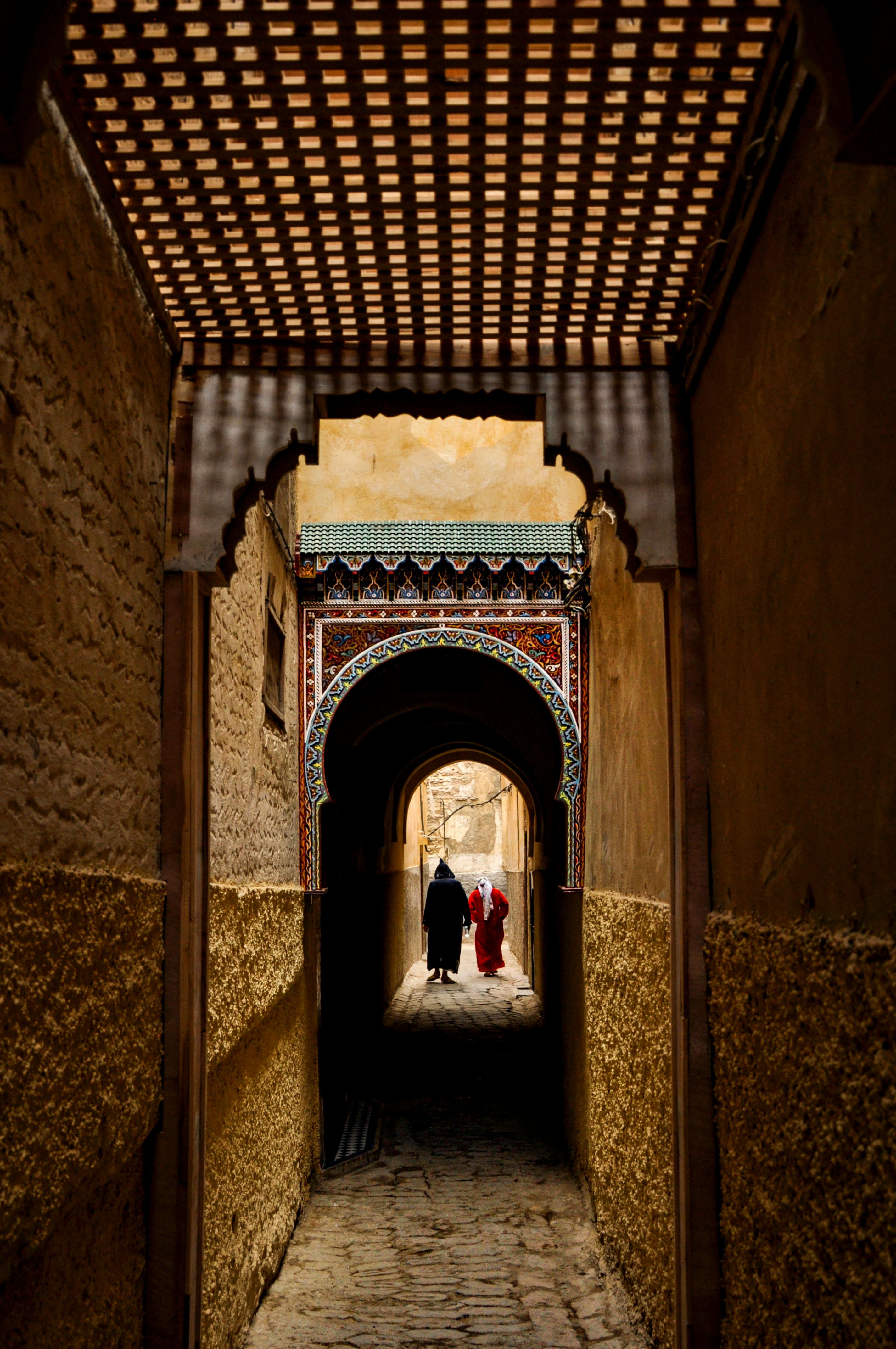 A Corridor with a Mosaic Arch · Free Stock Photo