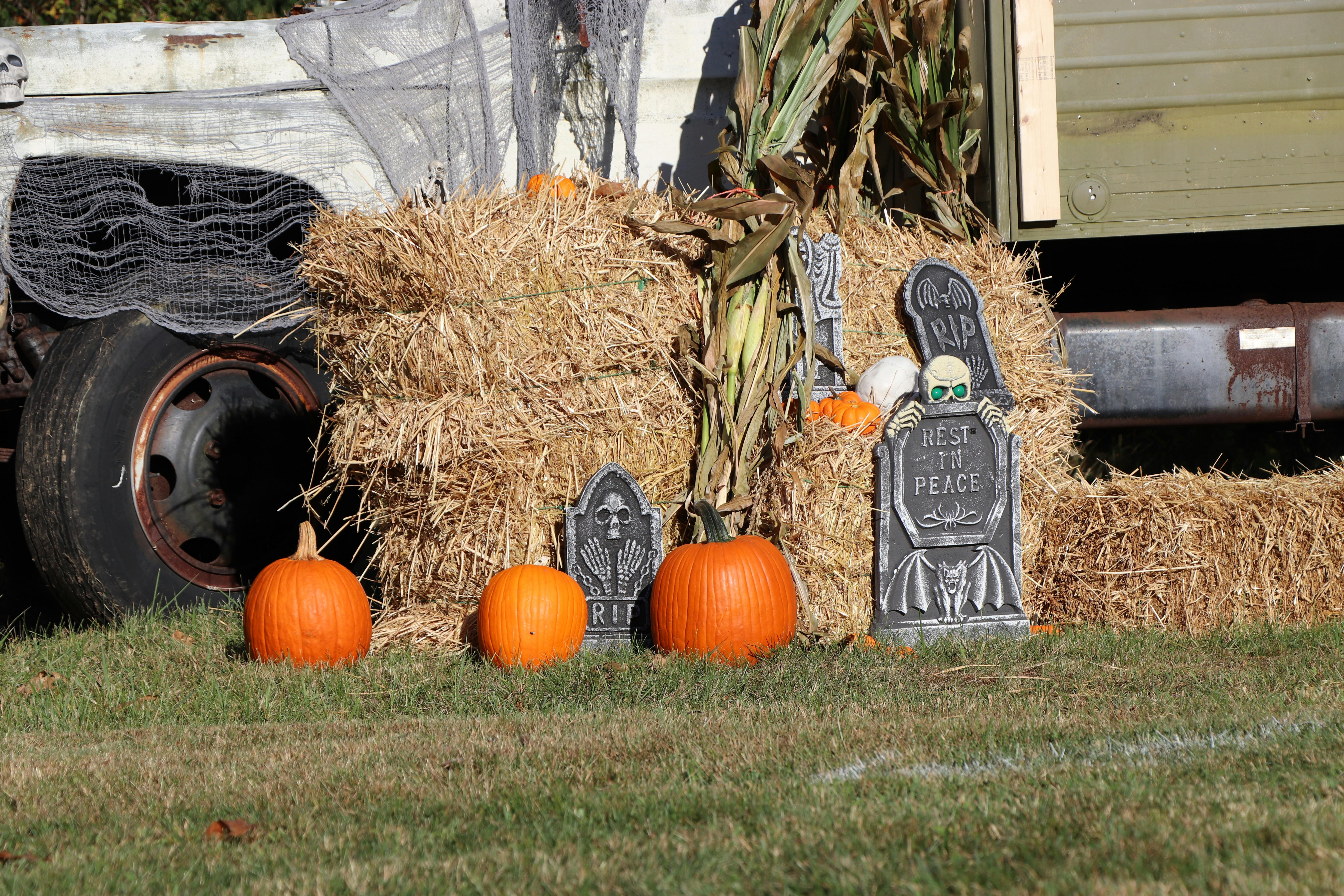 Halloween Composition with Hay and Tombstones · Free Stock Photo