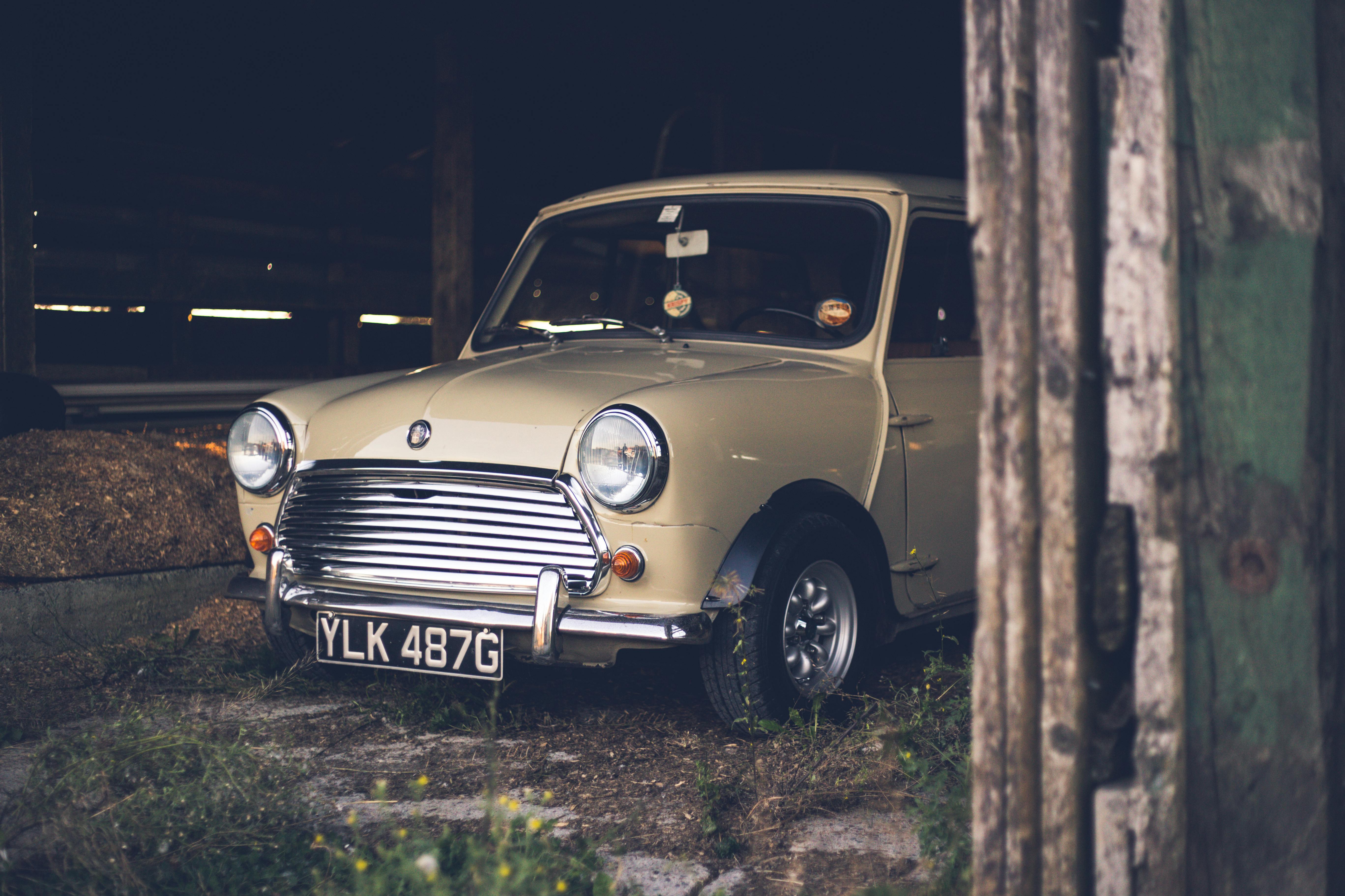 Old fashioned car parked in barn · Free Stock Photo