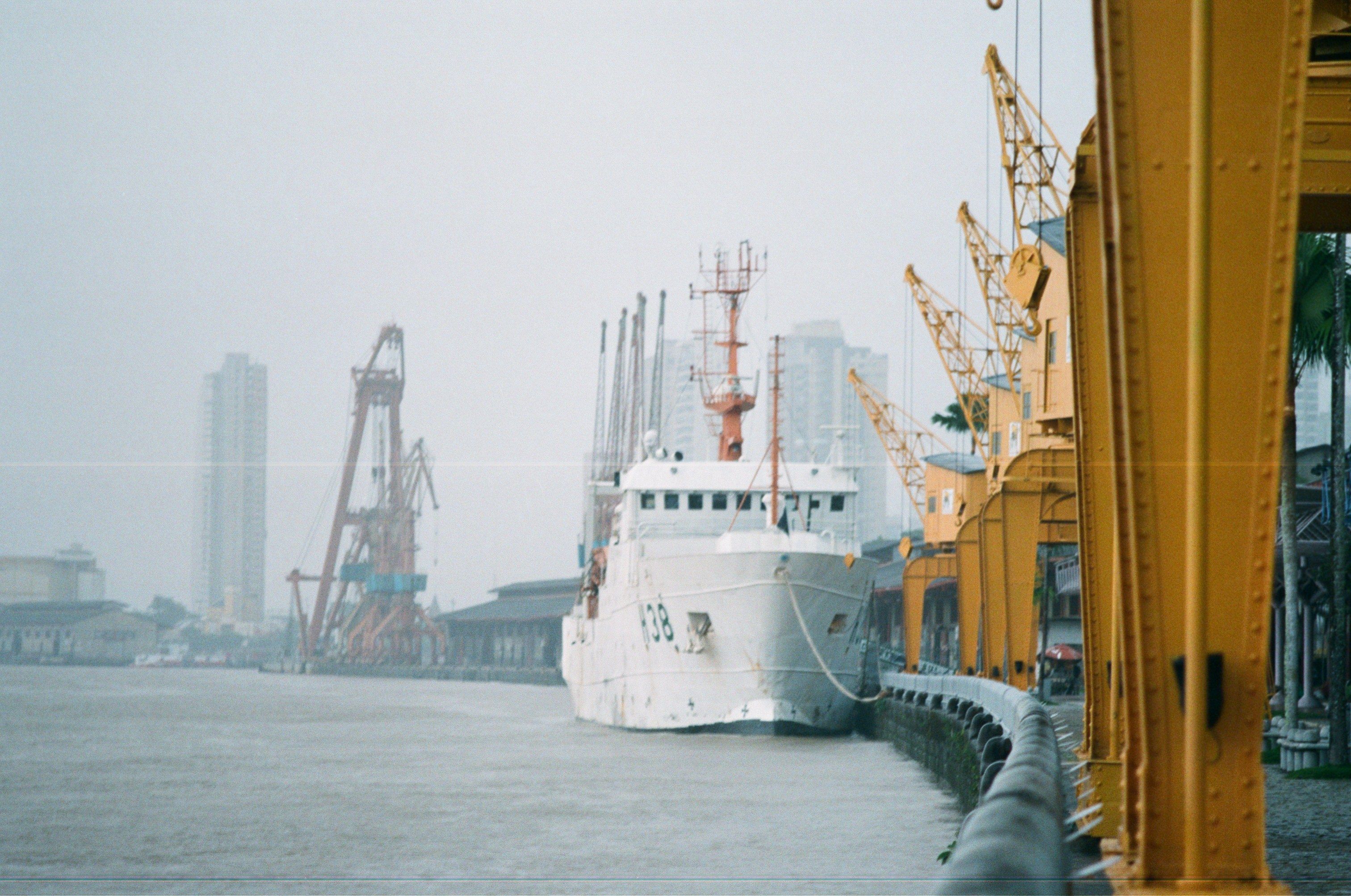 Ship moored in industrial cargo harbor · Free Stock Photo