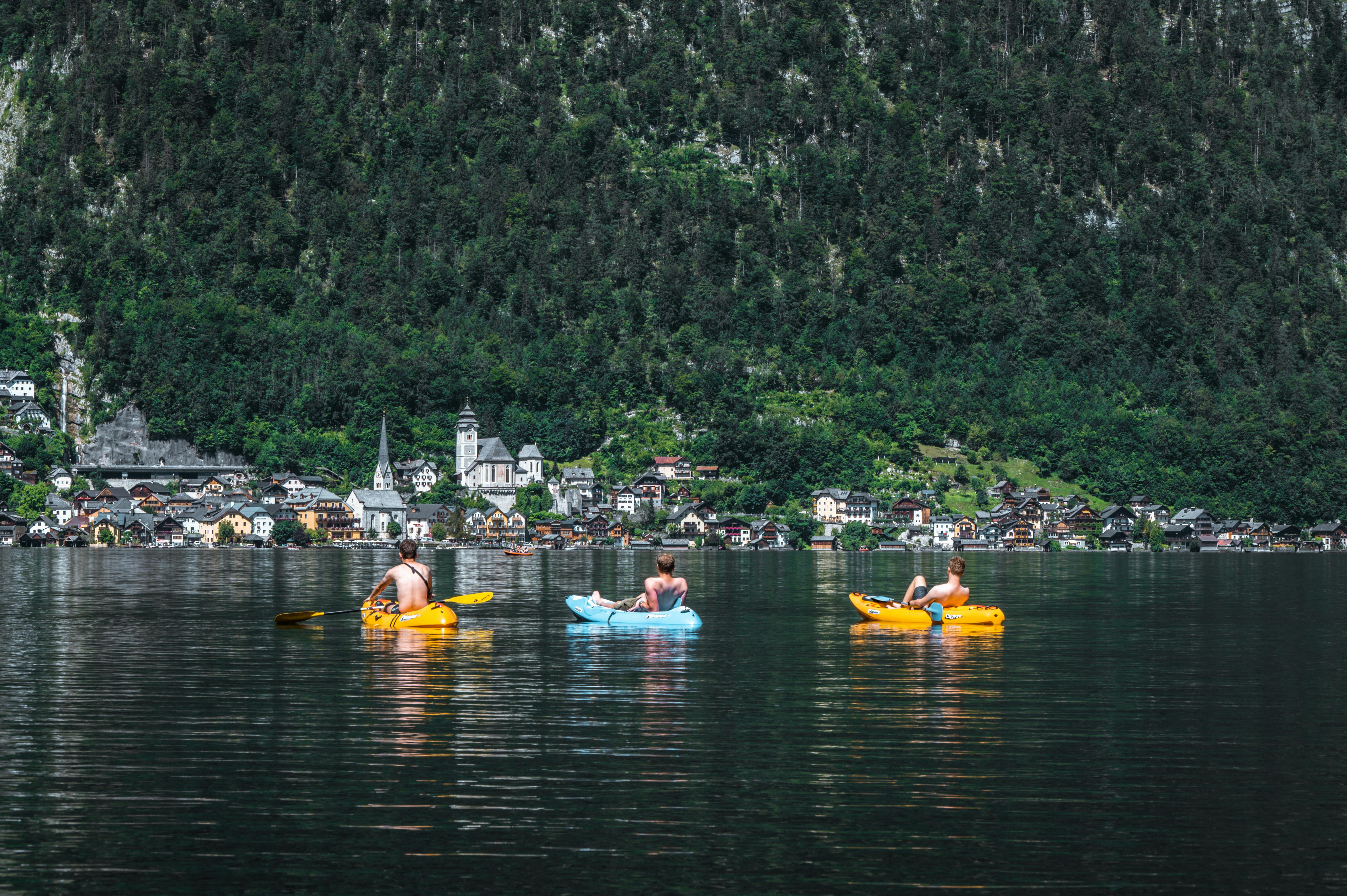 People Riding a Yellow Kayak on Lake · Free Stock Photo