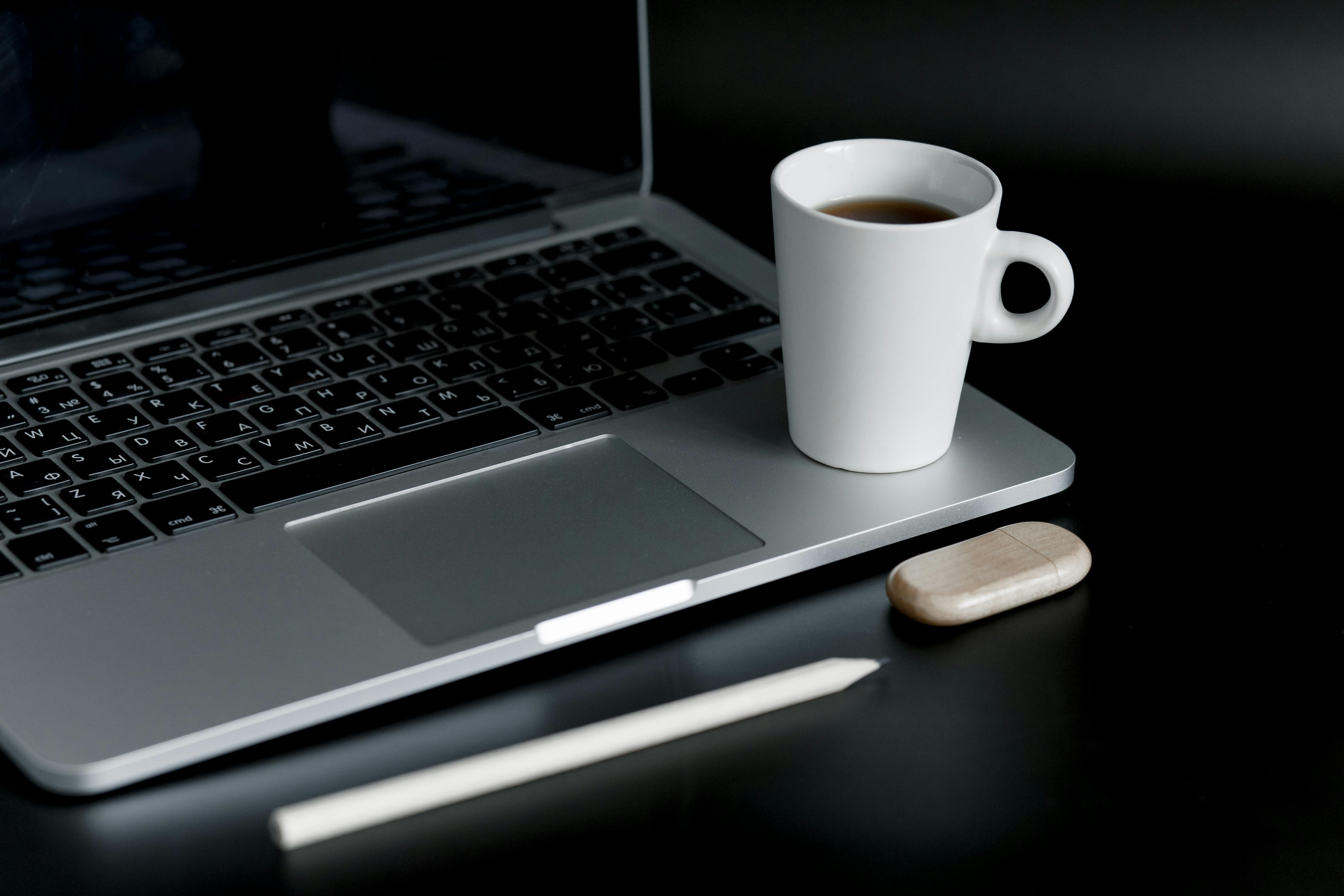 Laptop Computer and a Cup of Coffee · Free Stock Photo