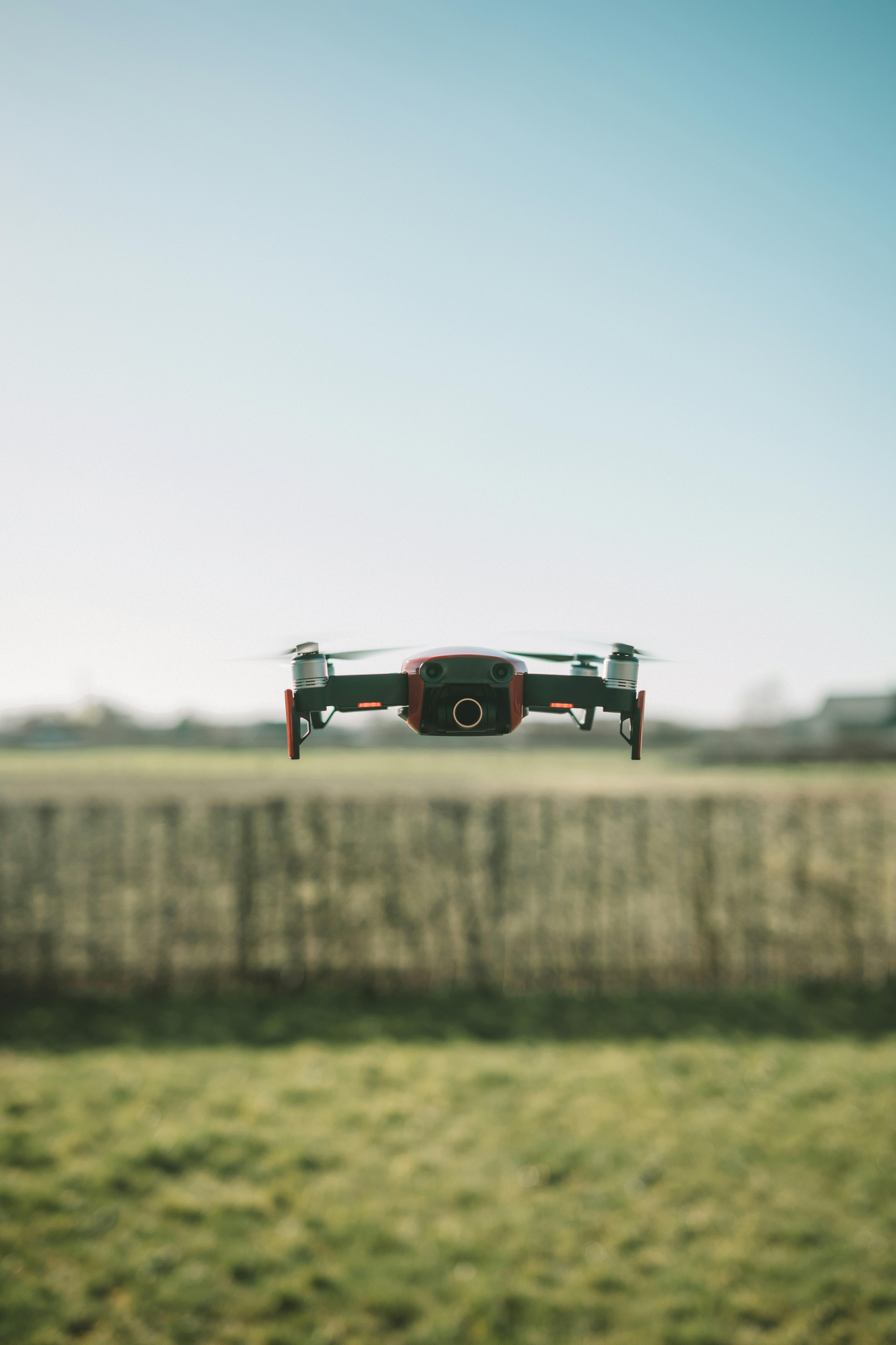 Drone Flying over Green Grass Field · Free Stock Photo