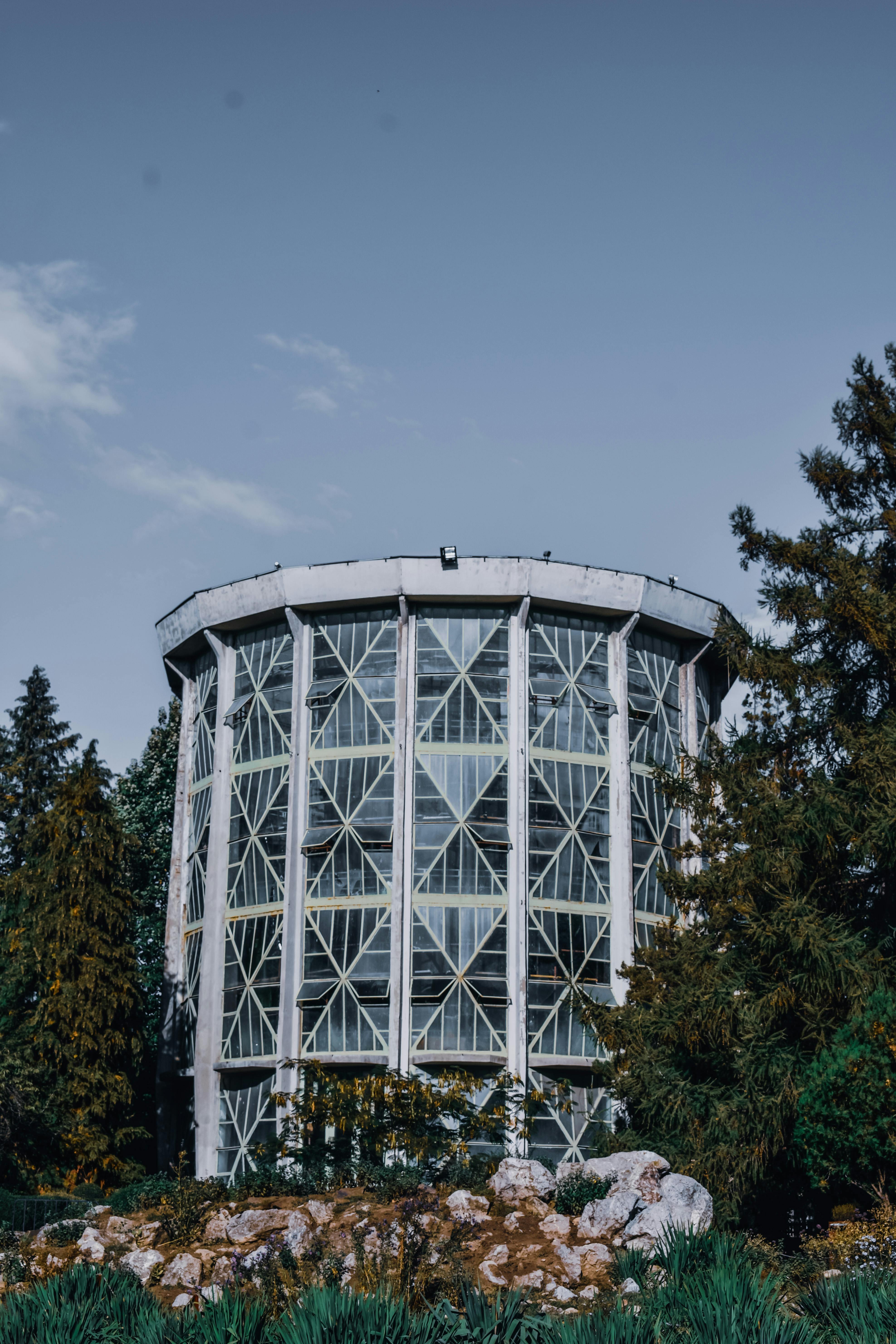 Round shaped building with stained windows in countryside area · Free ...