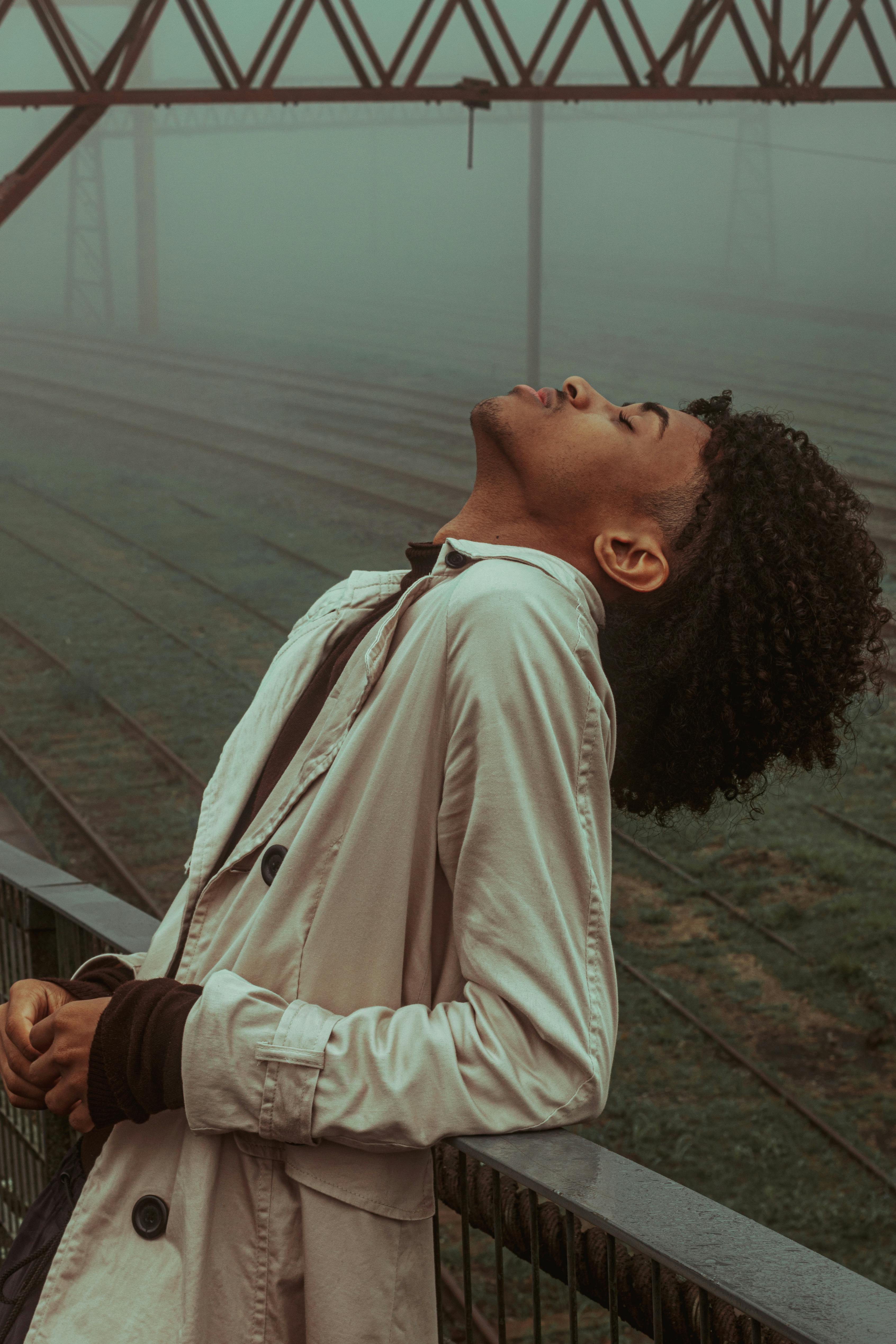 Man Leaning on Post · Free Stock Photo