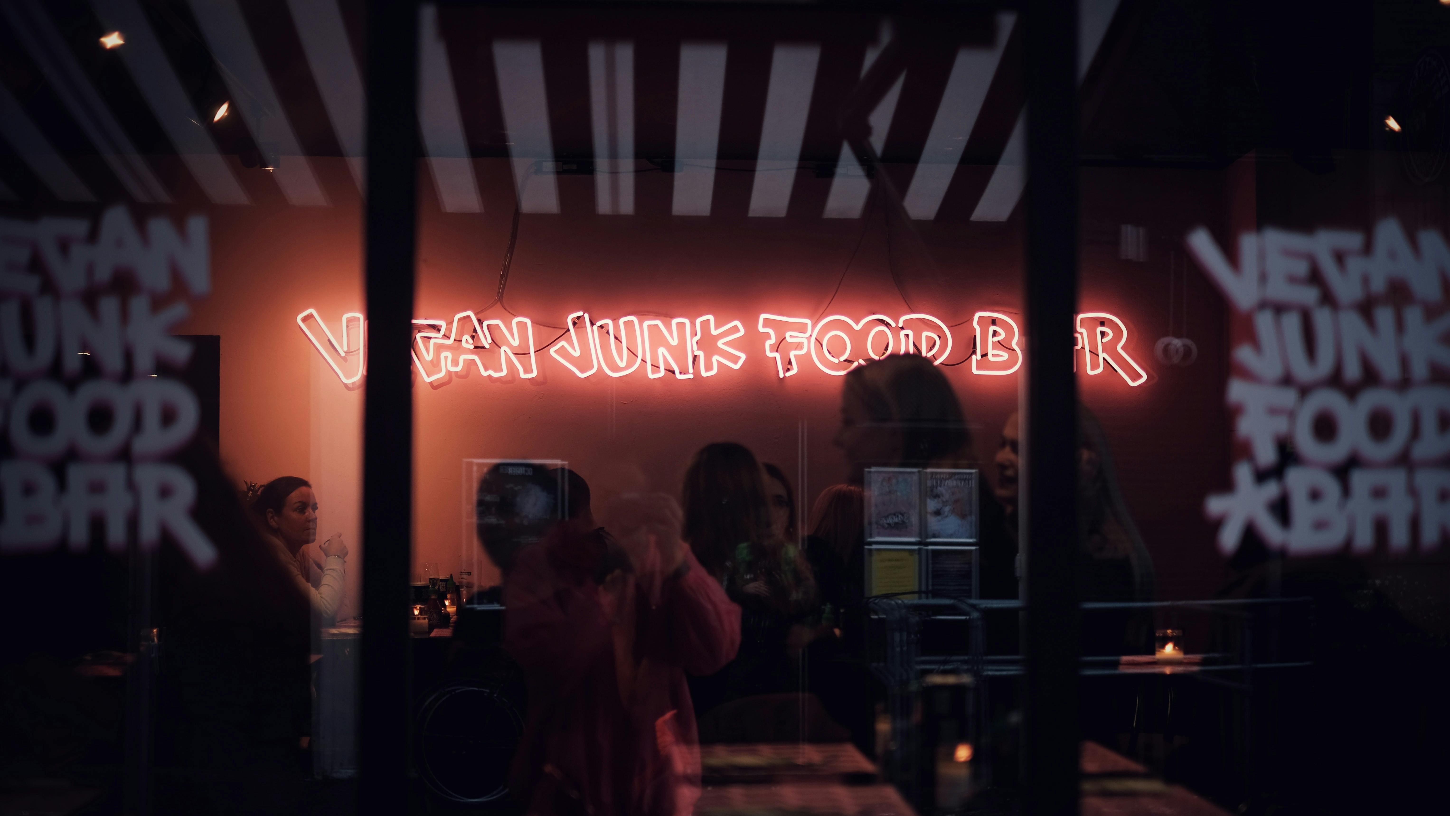 Shiny car at drive through cafe at night · Free Stock Photo