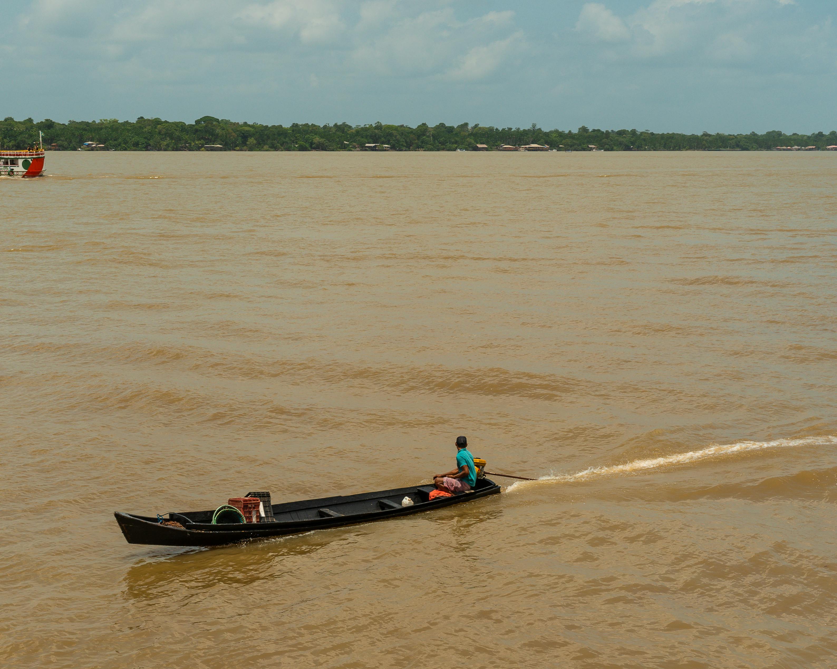 Man Riding a Boat · Free Stock Photo