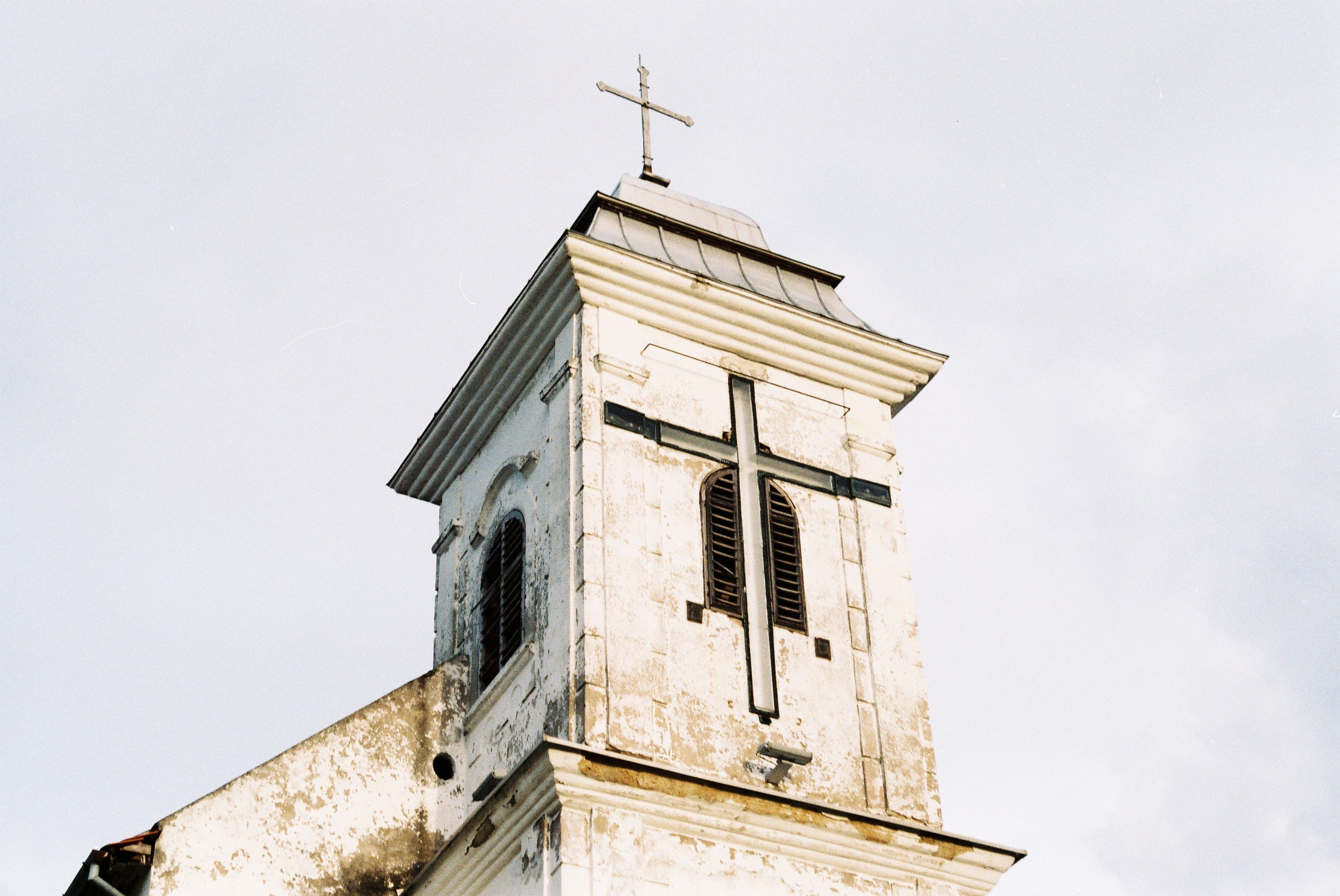 White Concrete Church Tower Under White Sky · Free Stock Photo