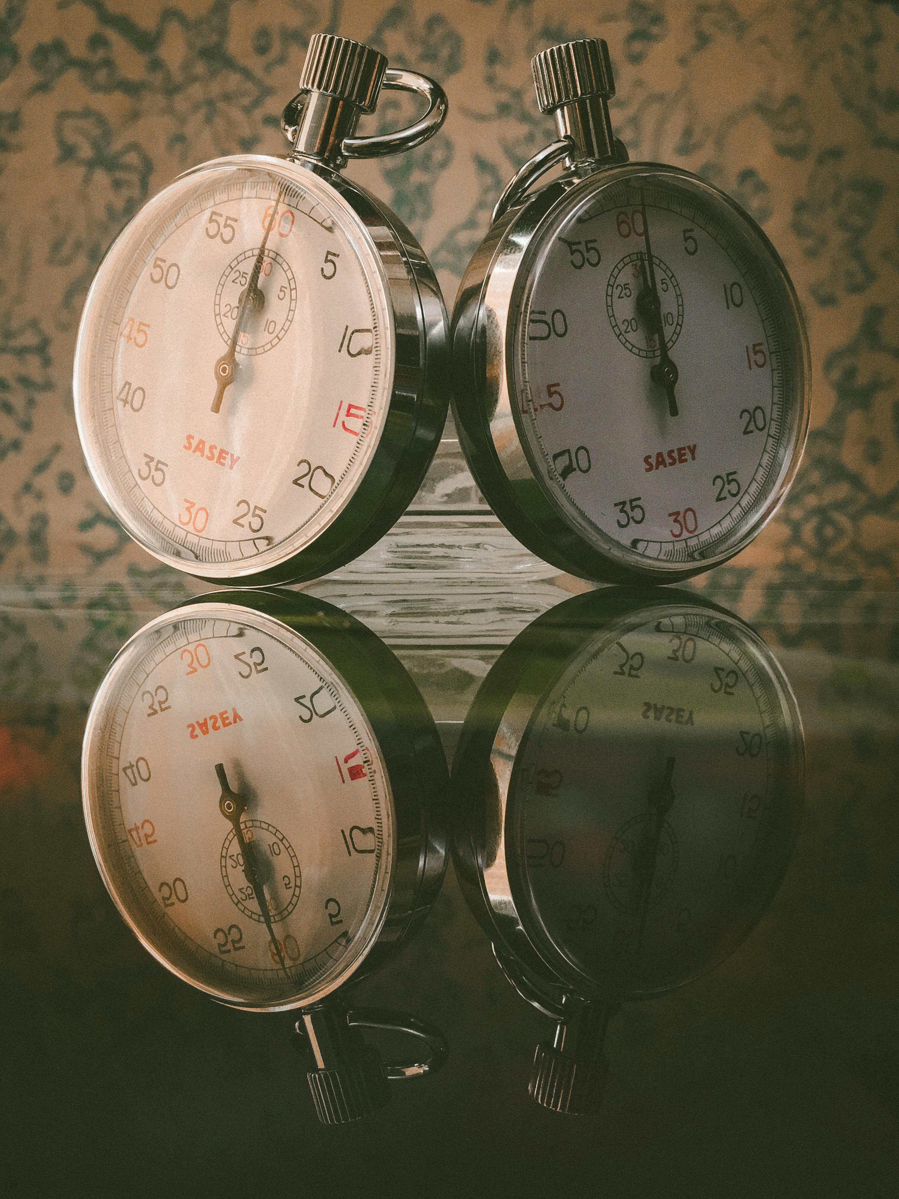 Close-up Photo of Analog Clocks · Free Stock Photo