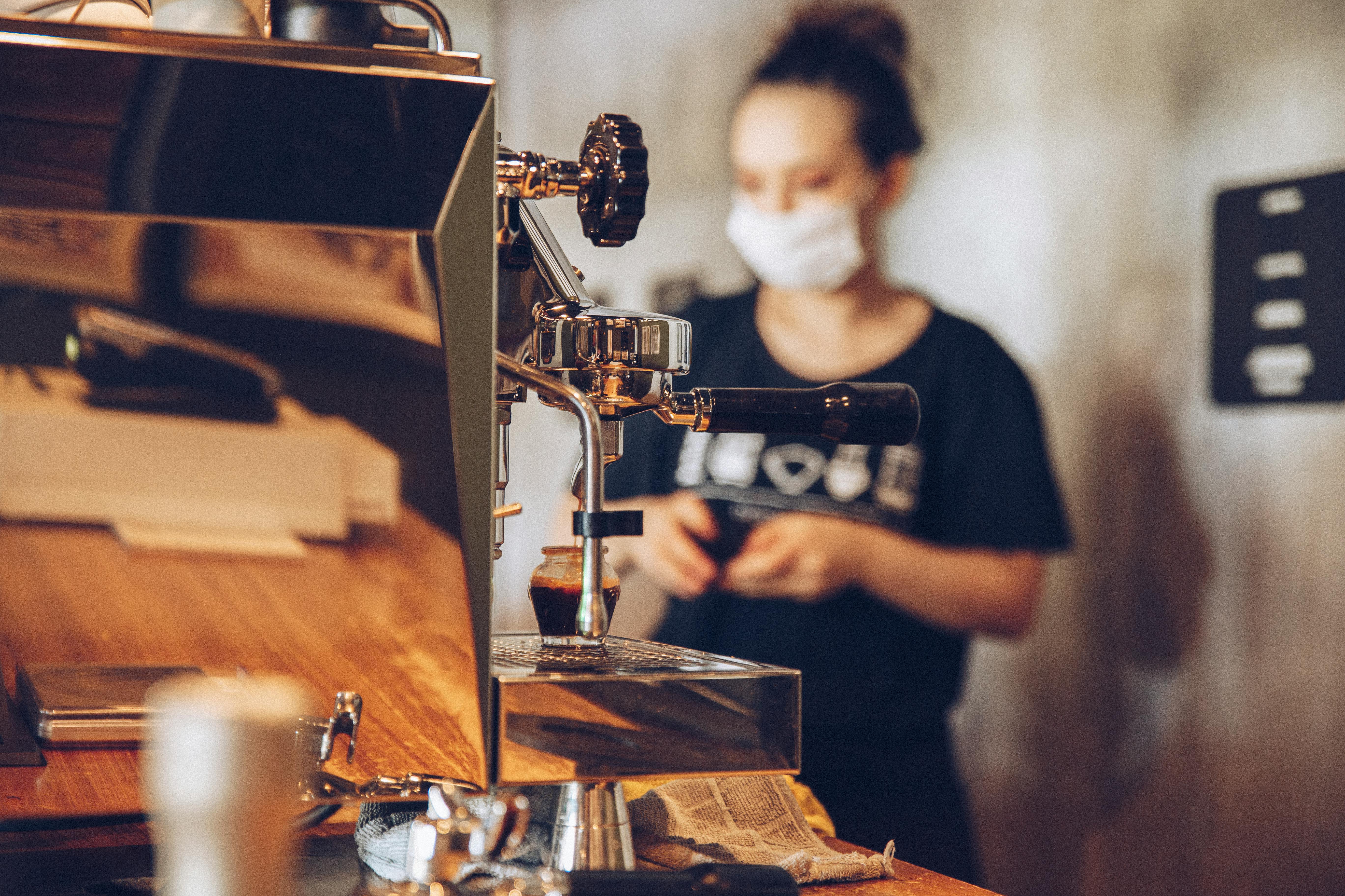 Person Using Espresso Machine · Free Stock Photo