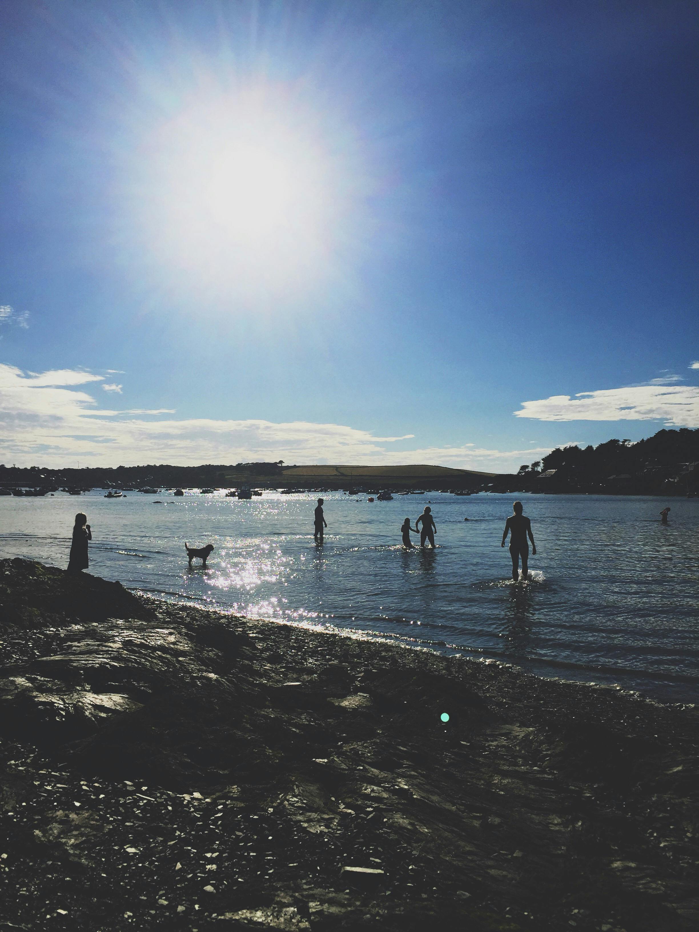 People Near Beach With Lifeguard Gazebo · Free Stock Photo