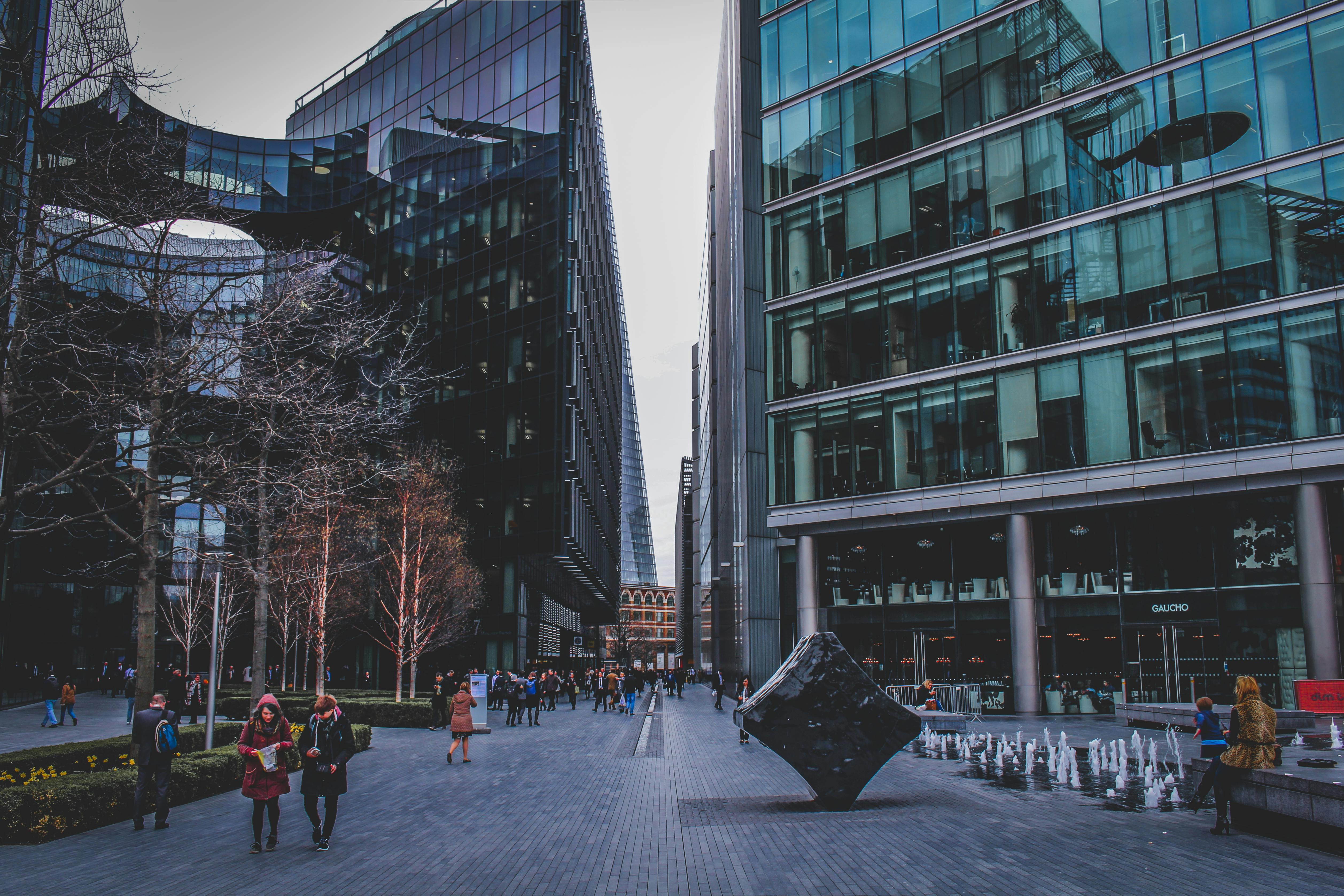 Two High Rise Buildings Near Peoples · Free Stock Photo
