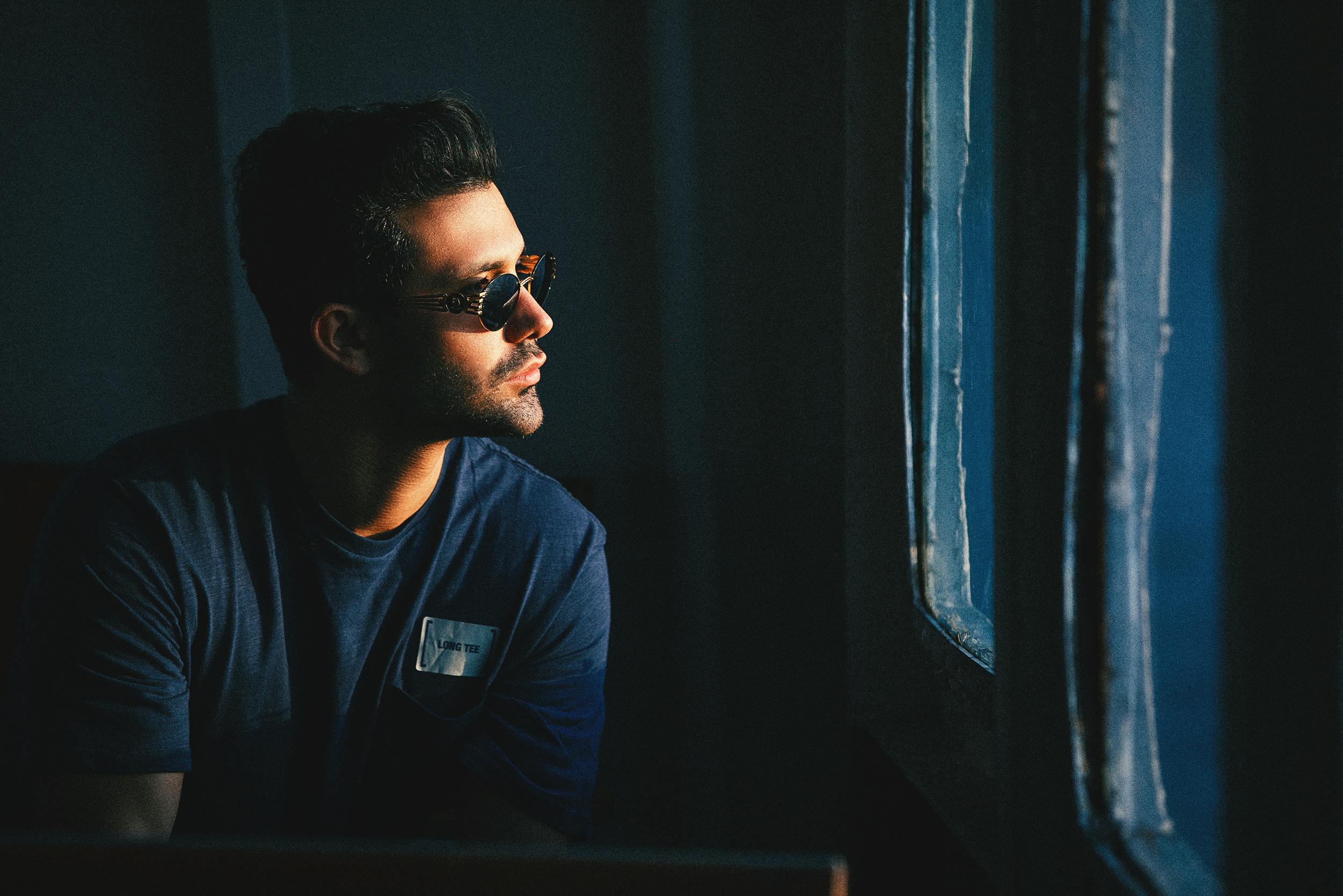 Male Teacher in Blue Long Sleeve Shirt Contemplating · Free Stock Photo