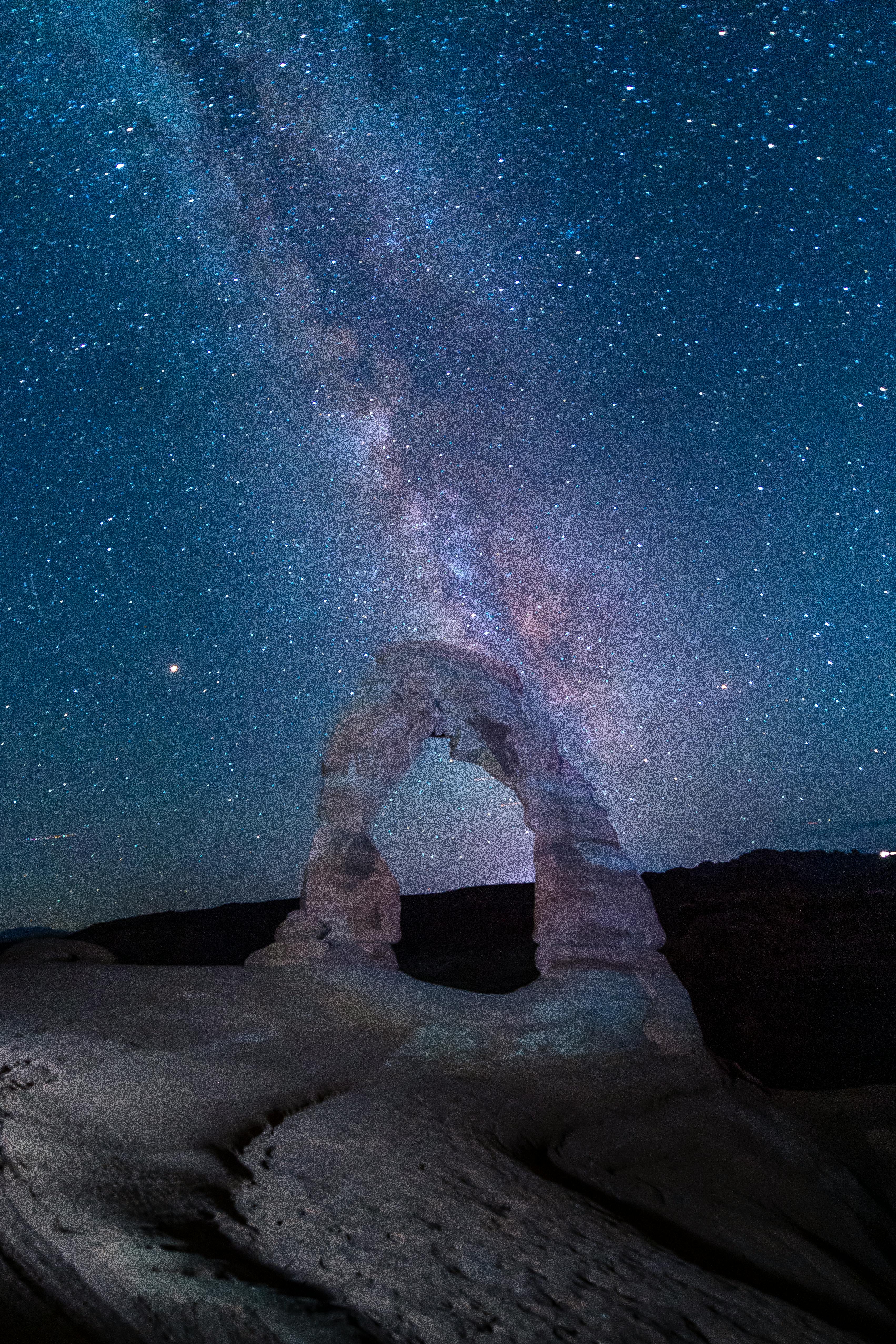 Arched Rock Formation under Starry Sky · Free Stock Photo
