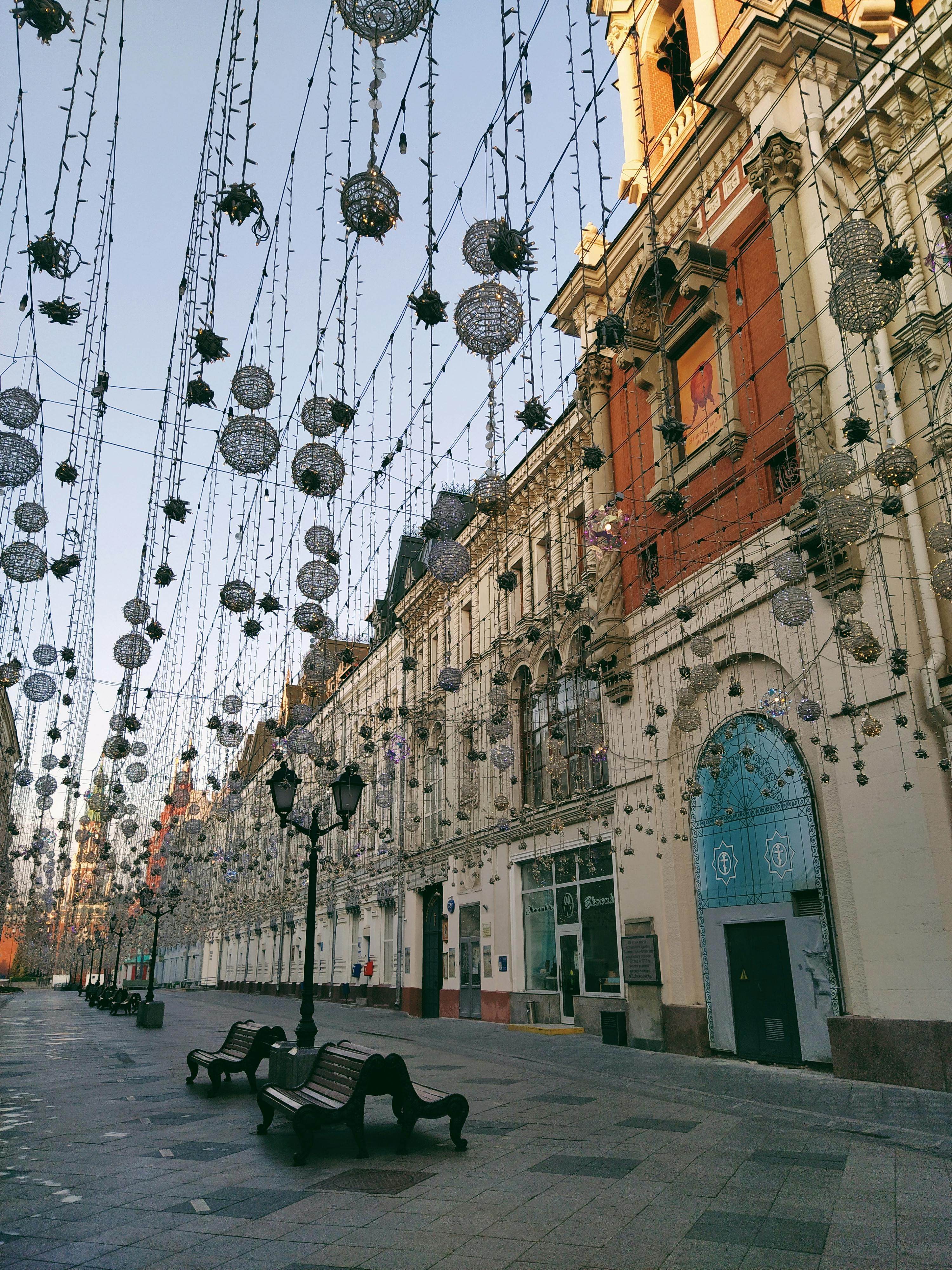 Assorted Color Umbrella Hanging between Buildings · Free Stock Photo