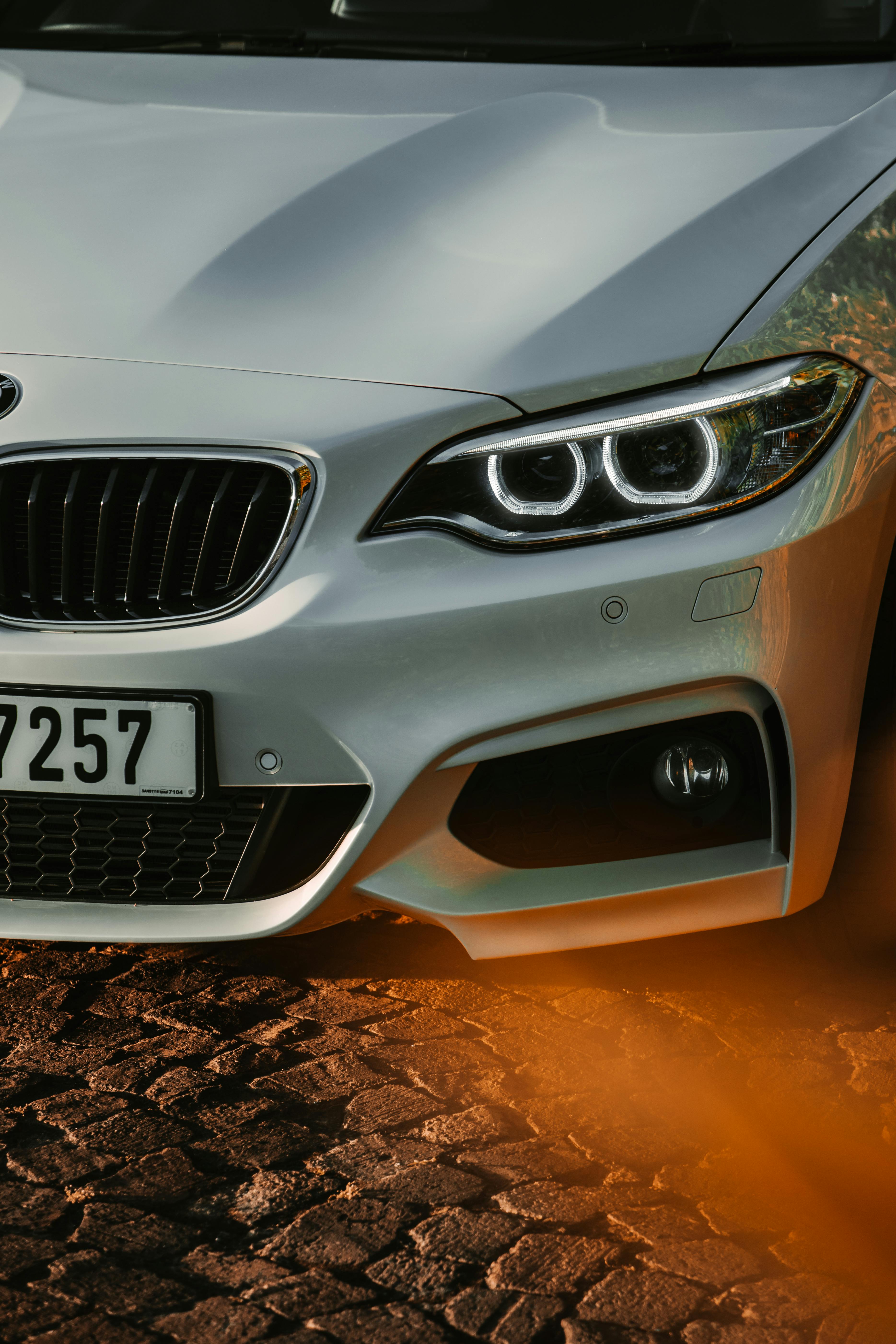 Close-Up Photo of White Car · Free Stock Photo