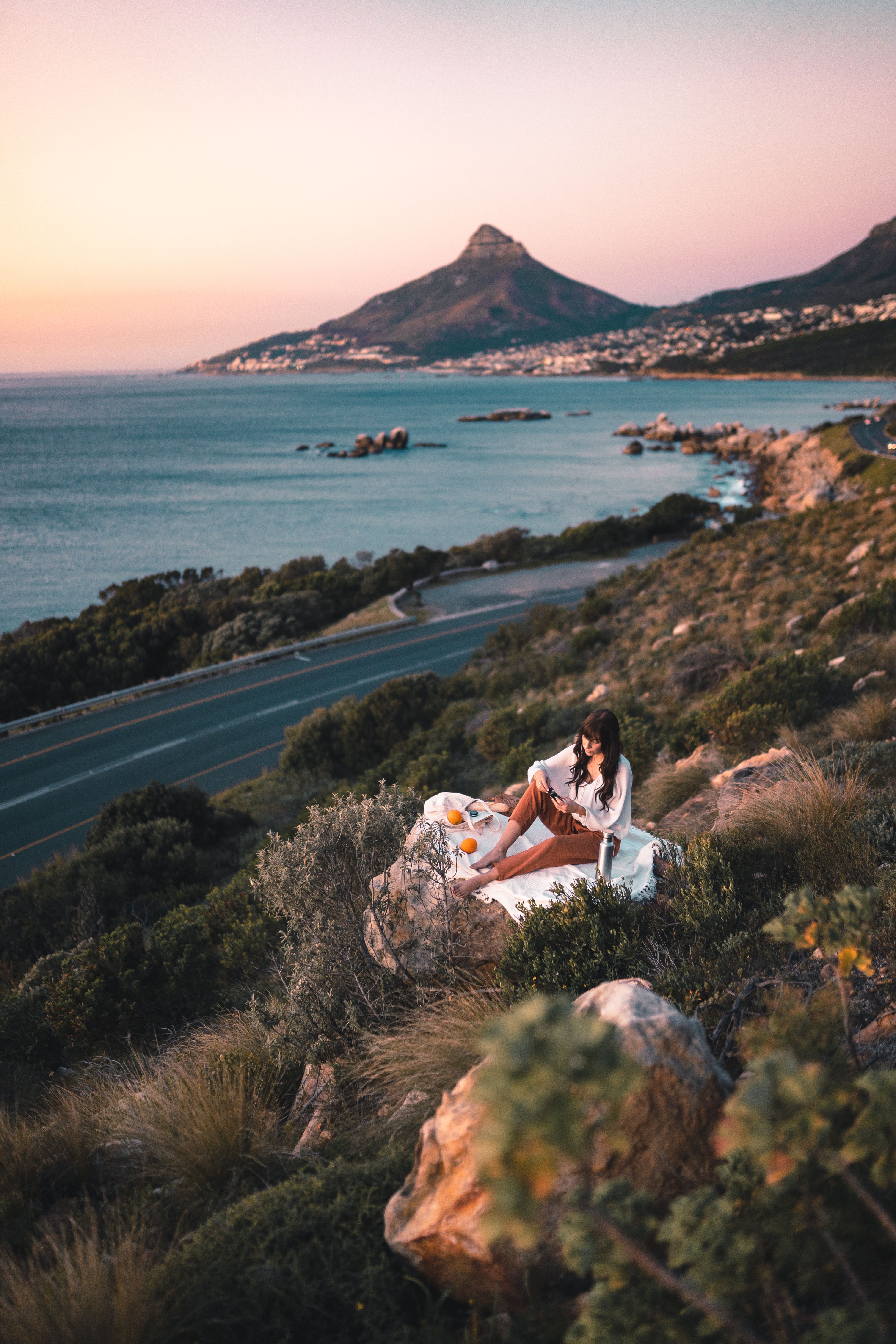 A Woman Resting on a Rock · Free Stock Photo