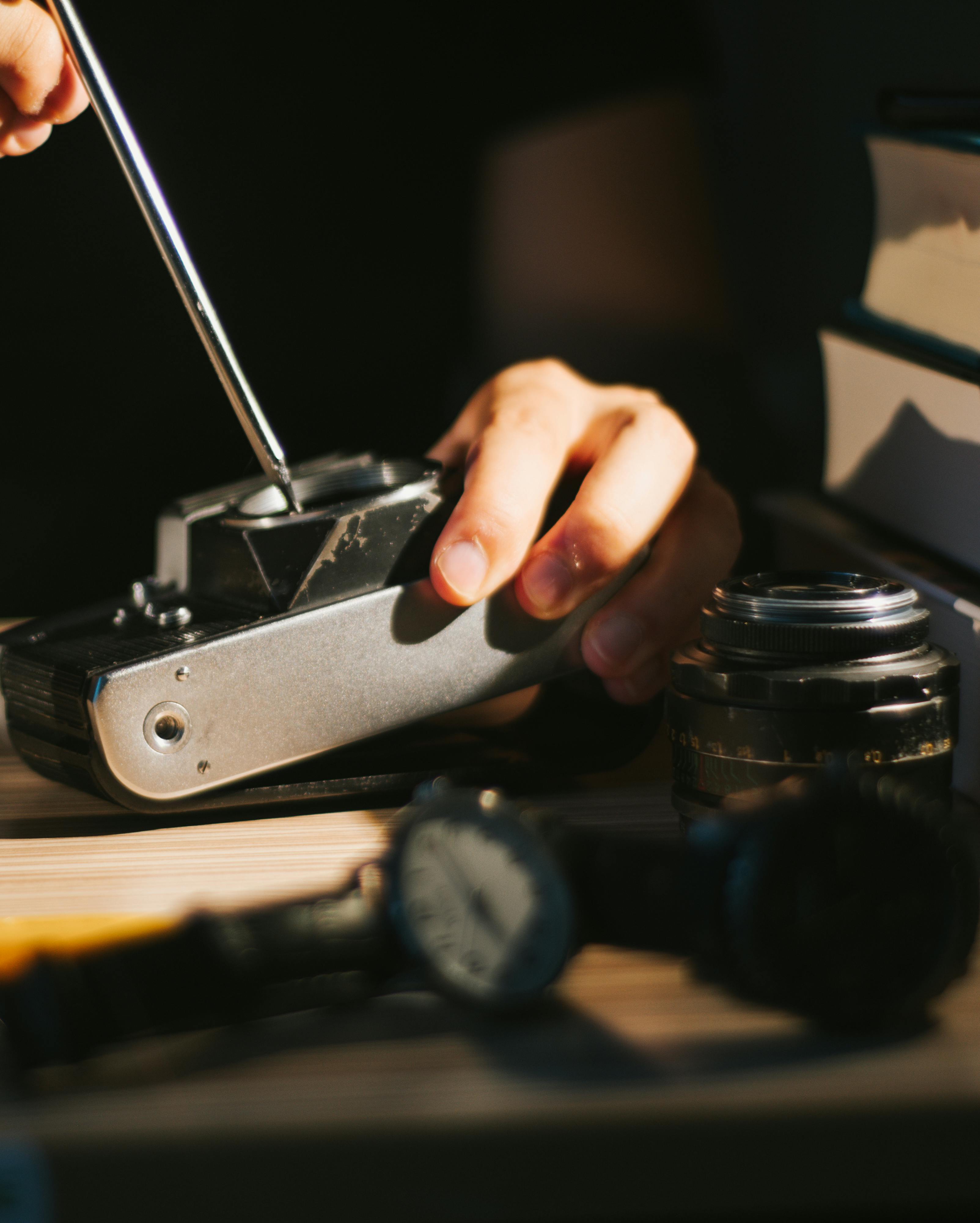 Close up of a Person Repairing an Object · Free Stock Photo