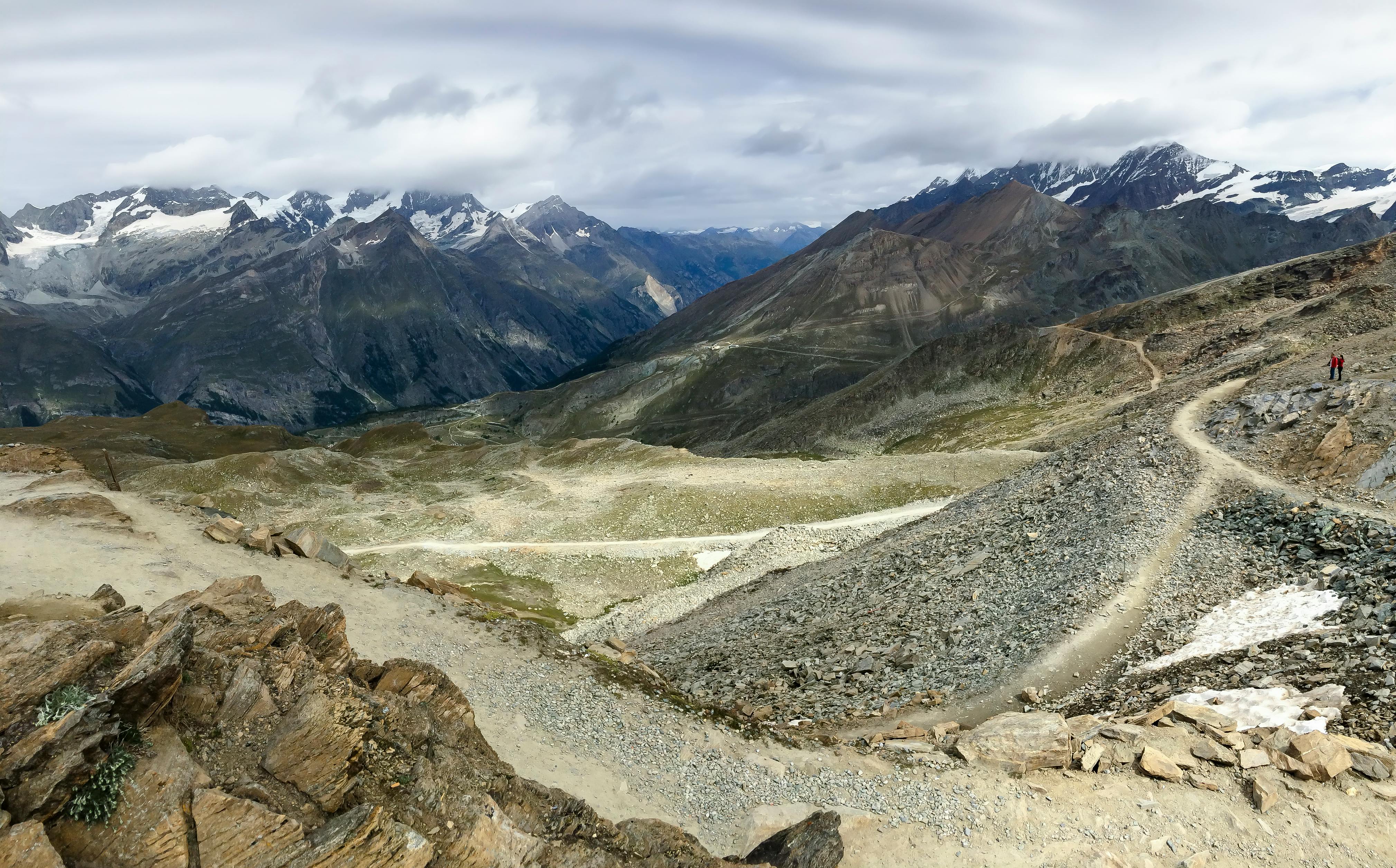 Gray Rocky Mountains Under Cloudy Sky · Free Stock Photo