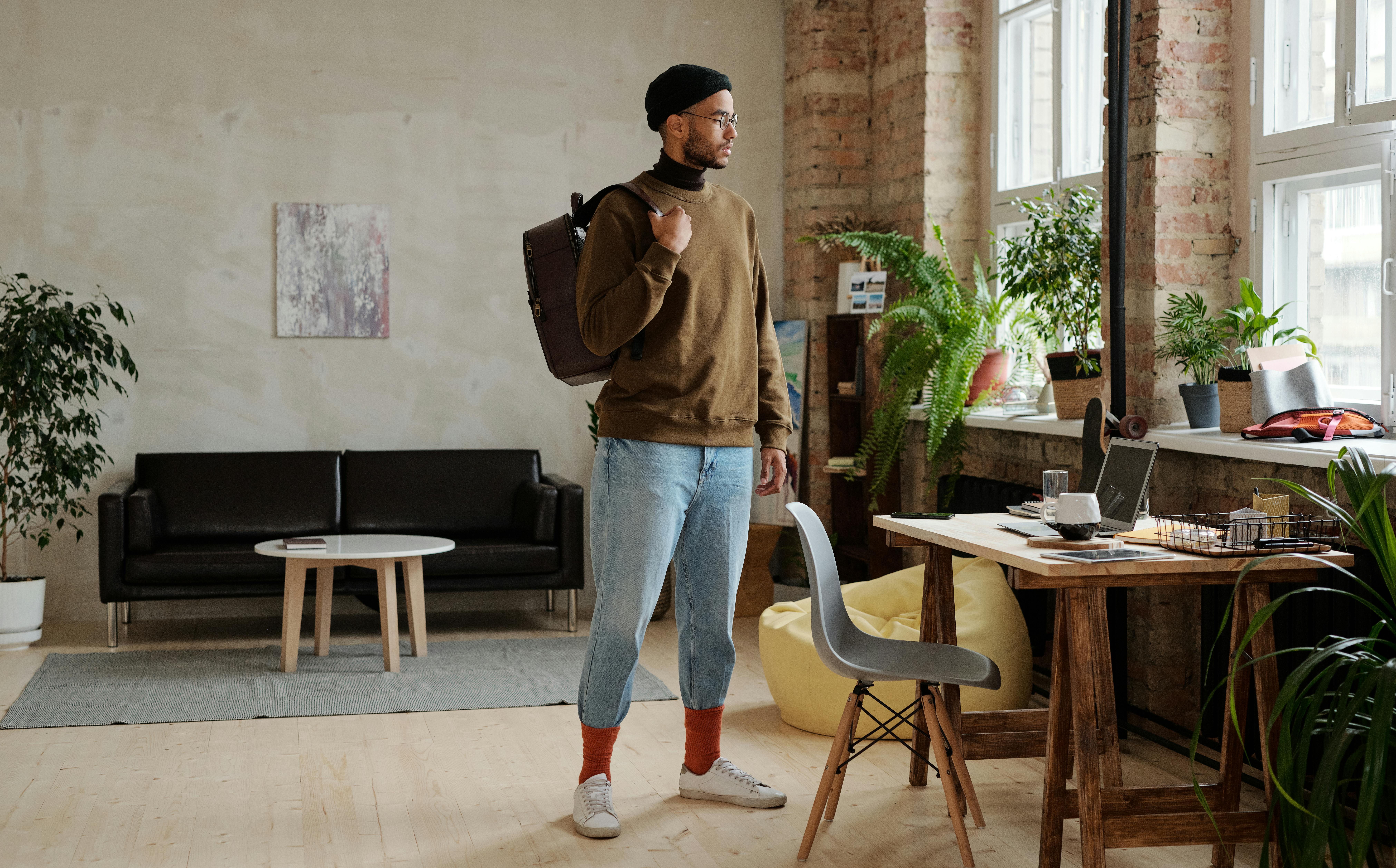 Stylish Man Standing in the Living Room · Free Stock Photo