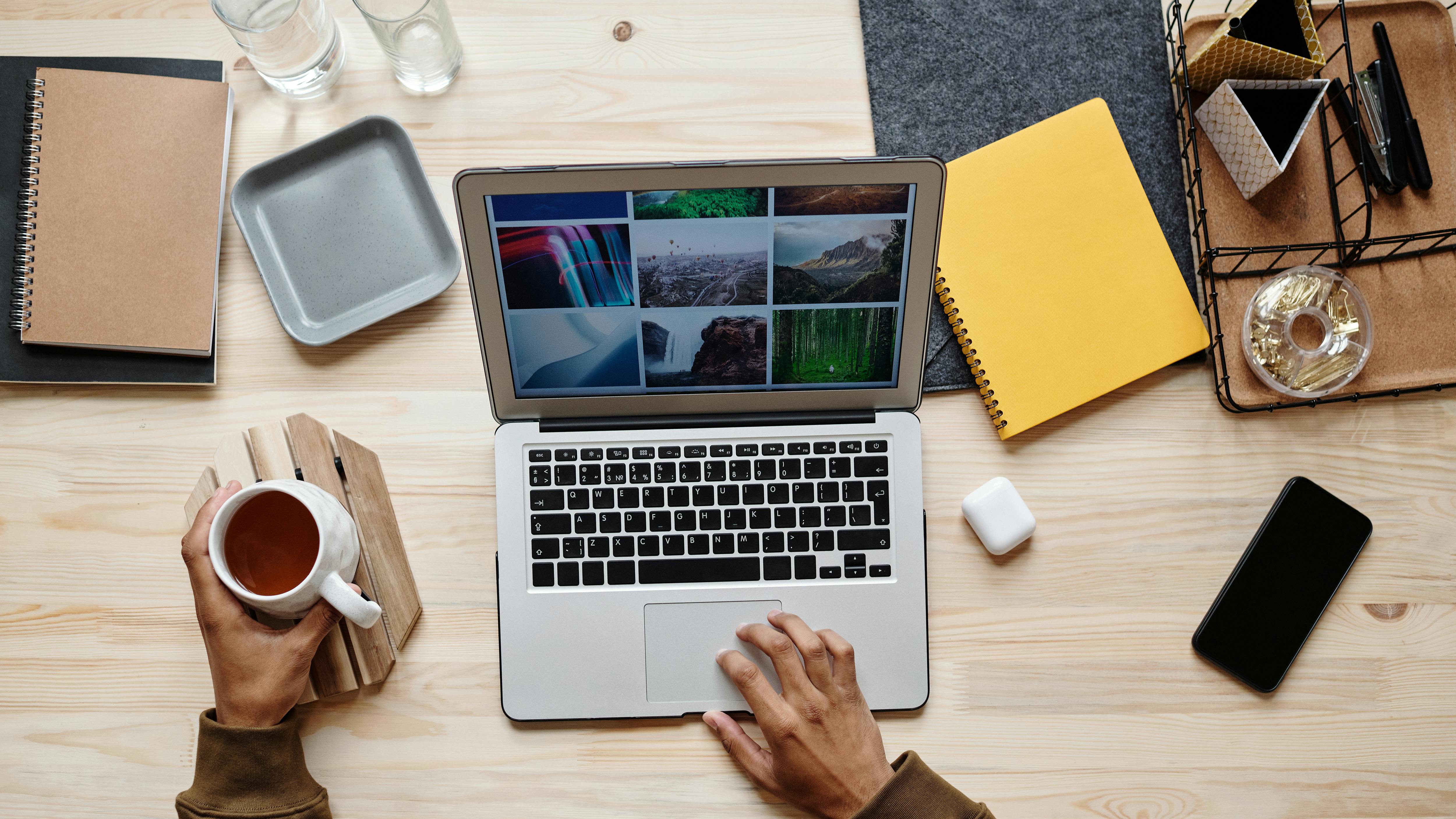 Macbook Pro on Brown Wooden Table · Free Stock Photo