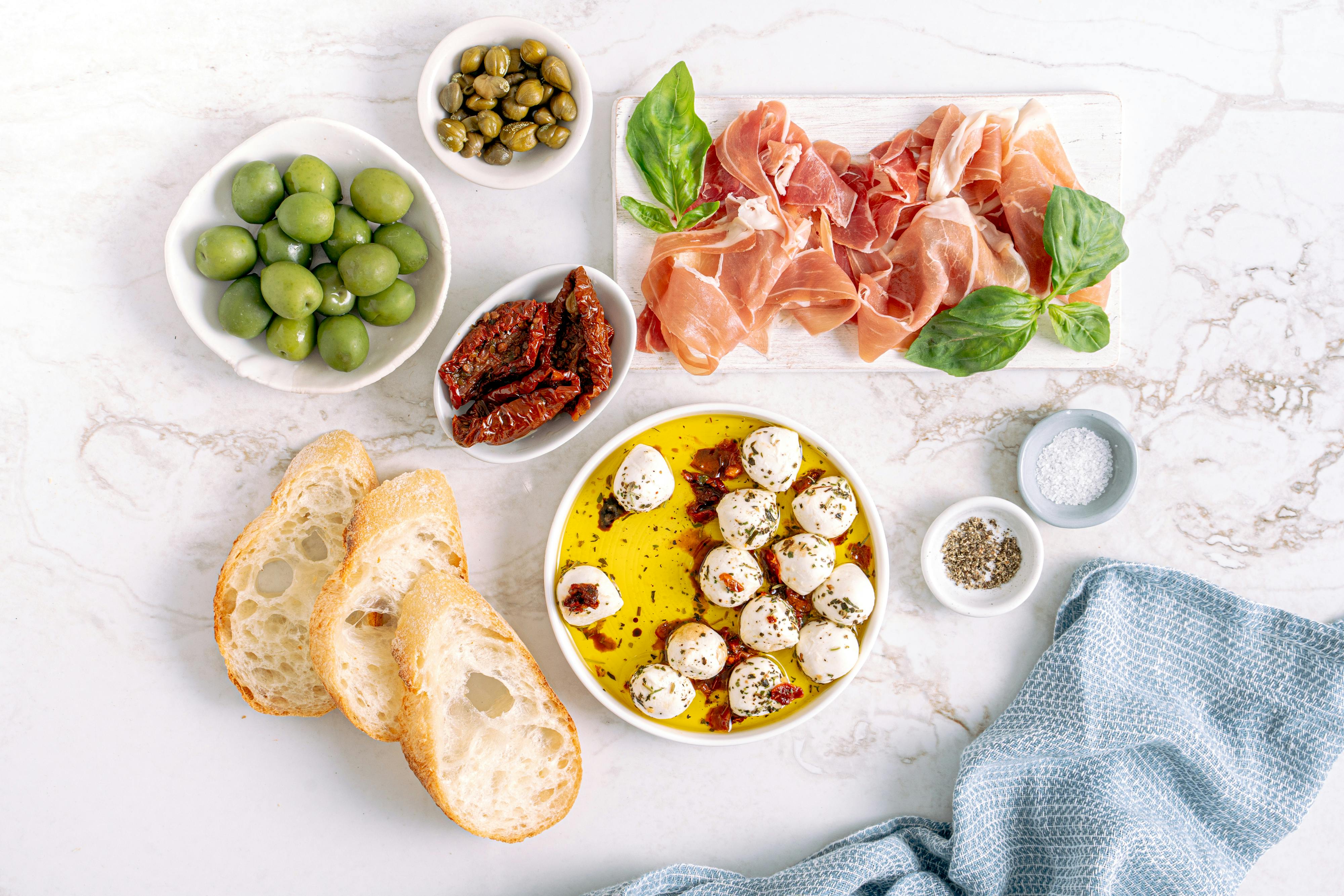 Mouth-watering Food Dishes on a Marble Surface · Free Stock Photo