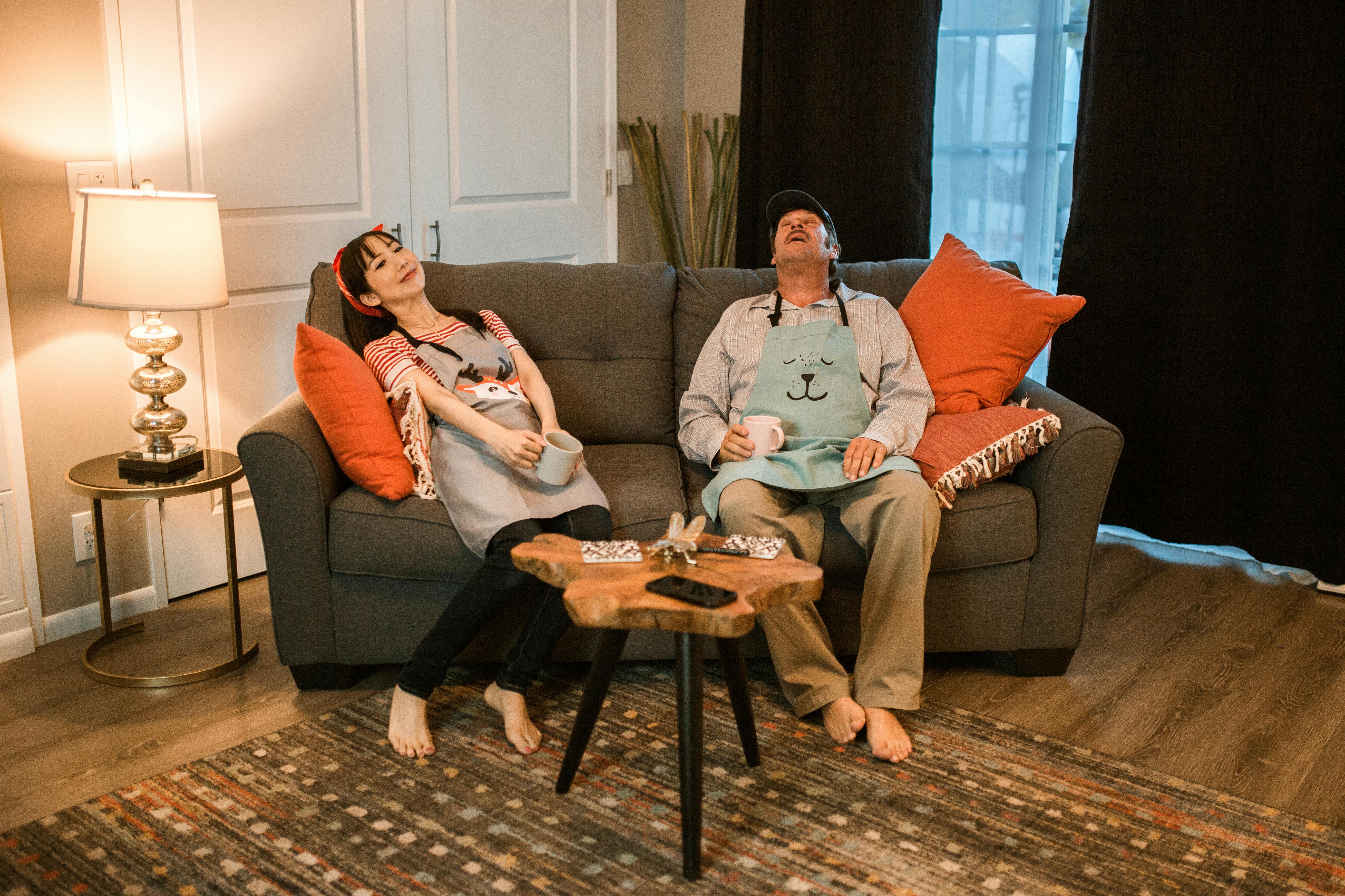A Couple Resting on a Couch · Free Stock Photo
