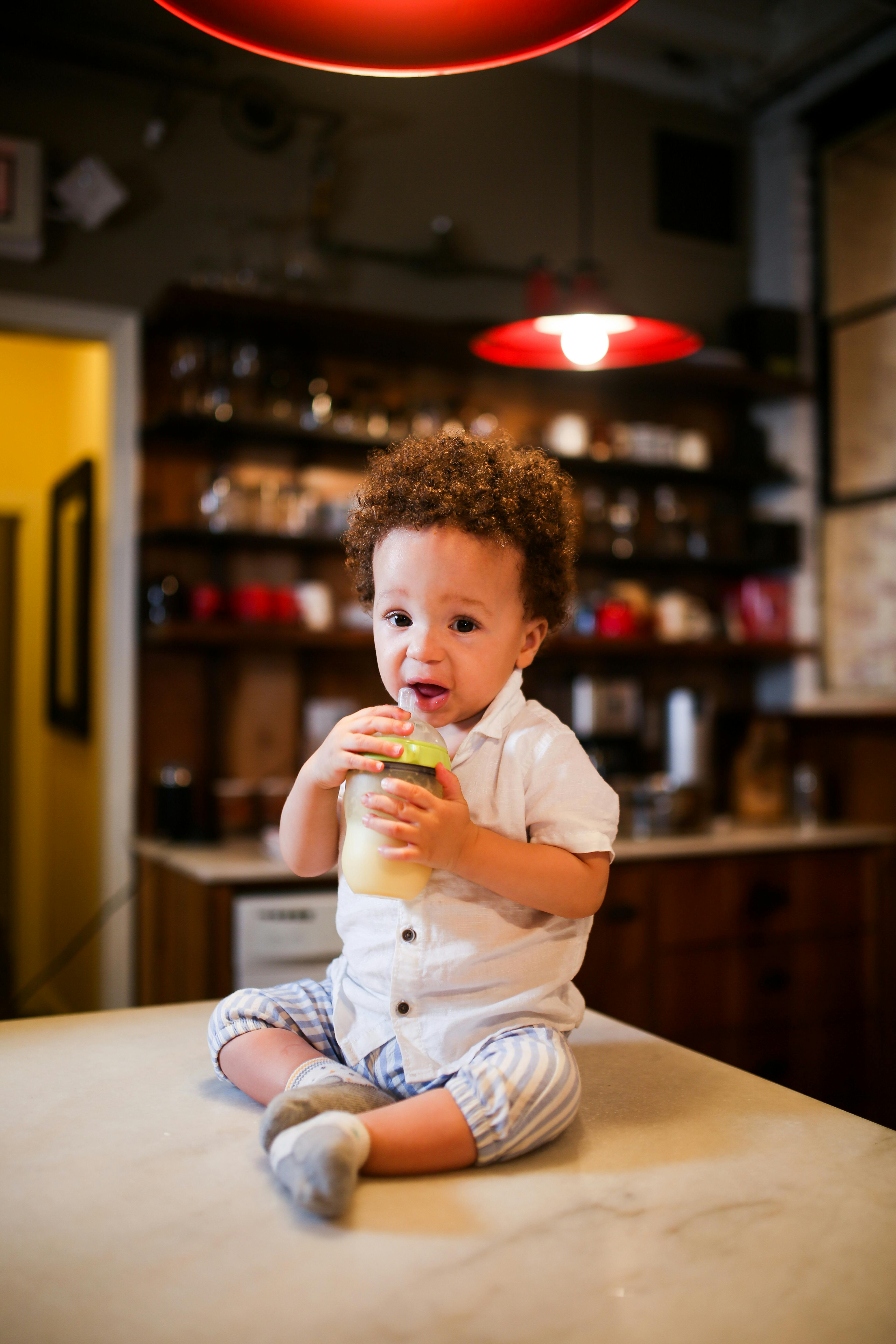 Kids Eating in a Kitchen · Free Stock Photo