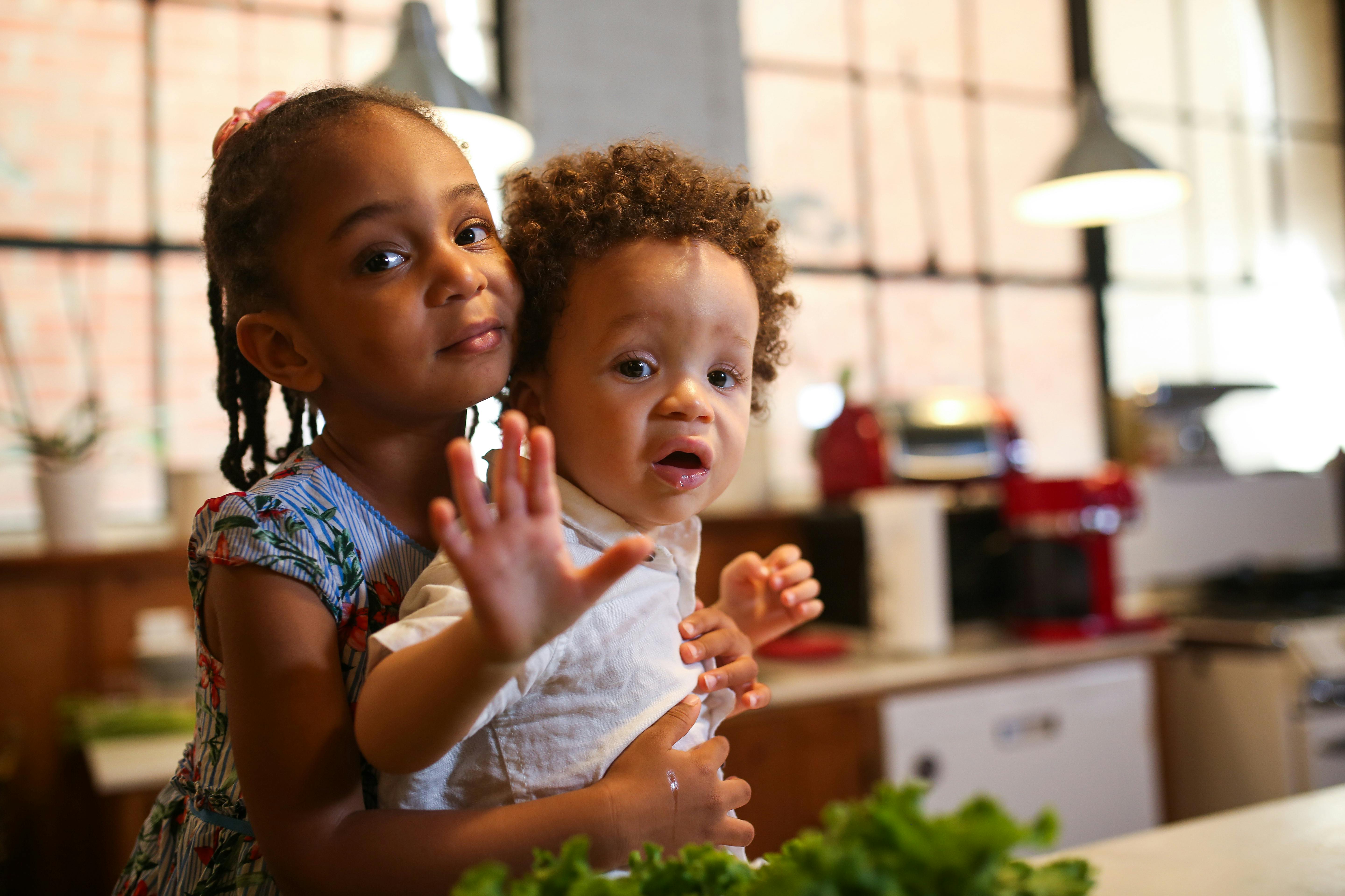 Child Eating Food at Kitchen Counter · Free Stock Photo