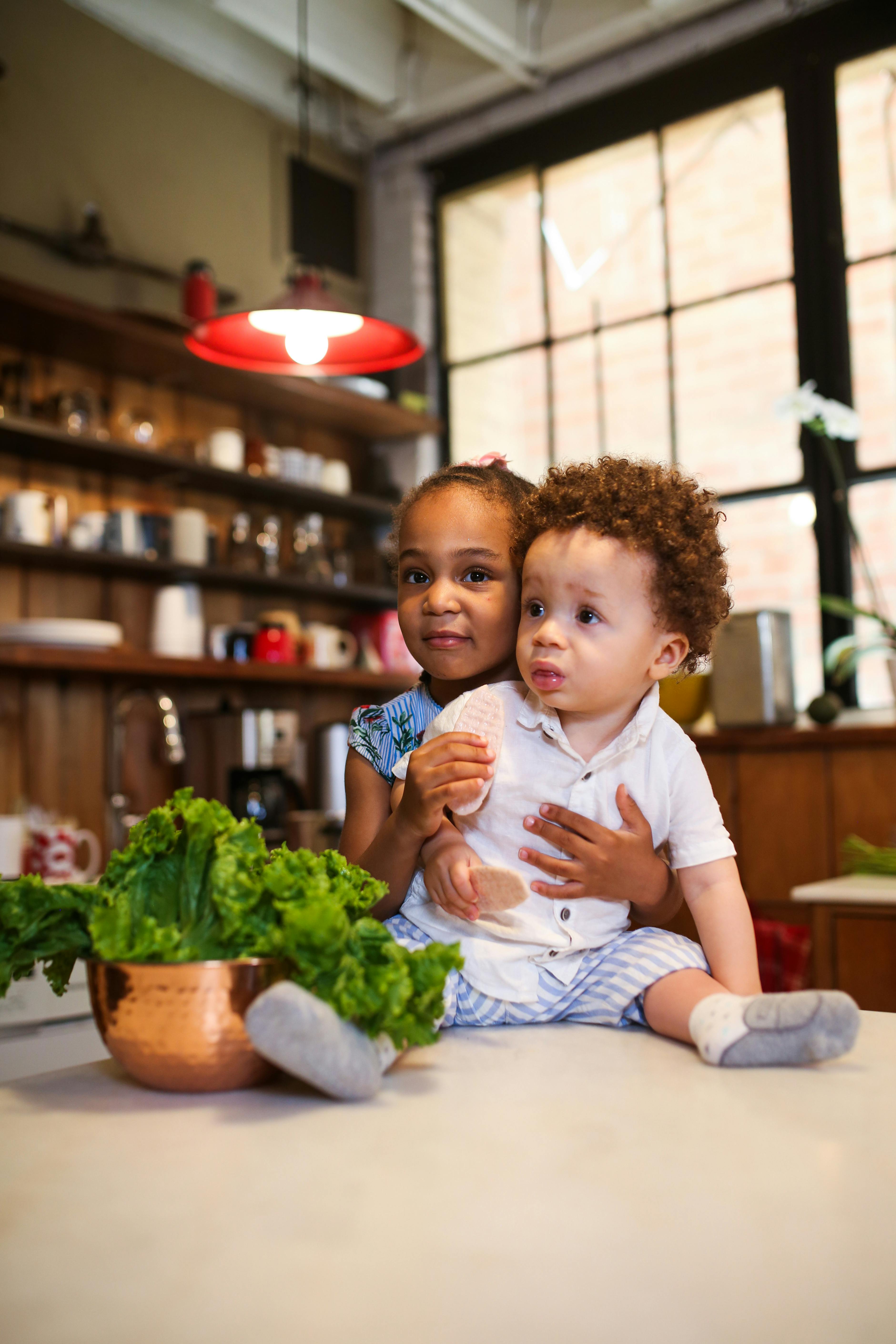 Kids Eating in a Kitchen · Free Stock Photo