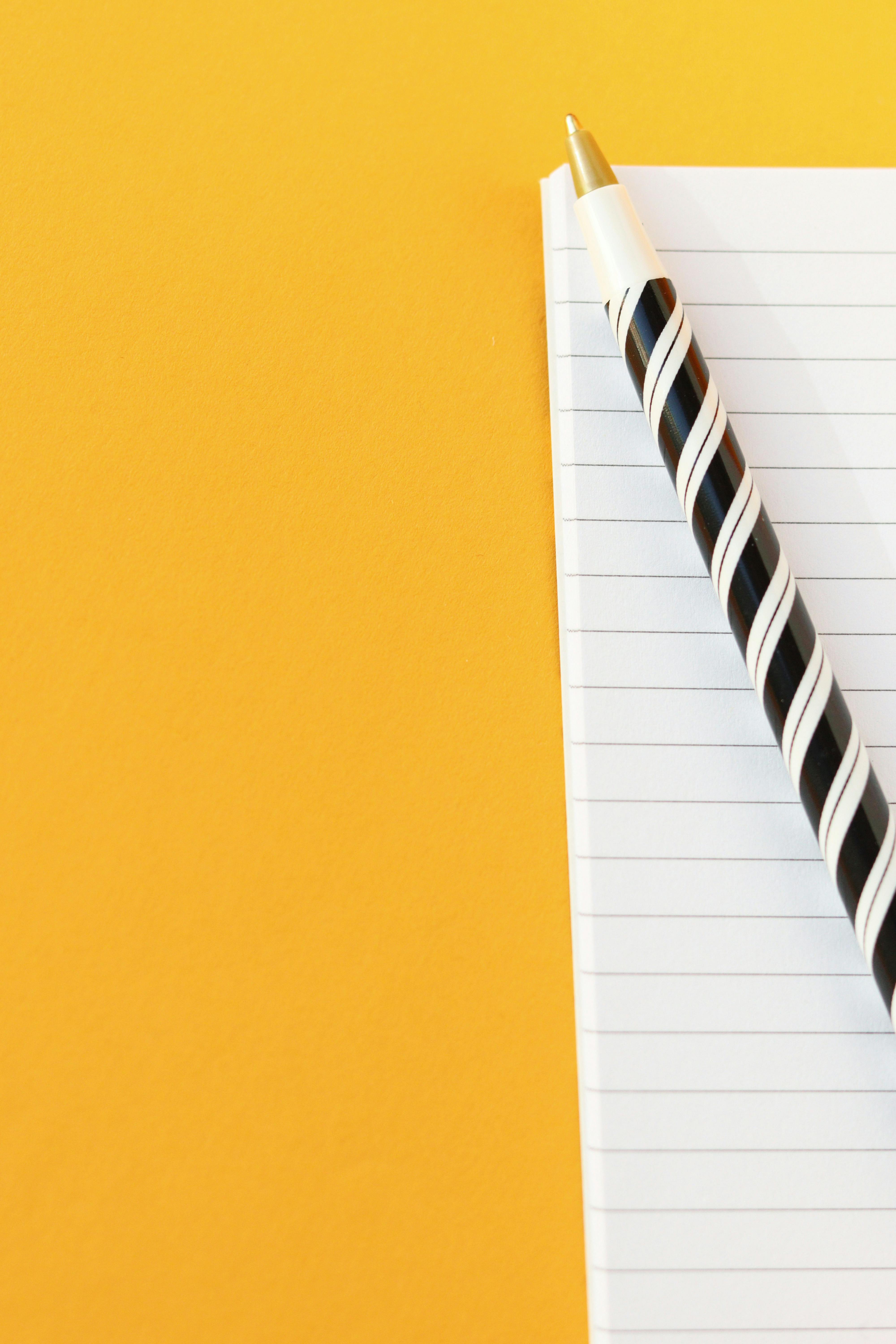 Yellow Journal over a Magazine · Free Stock Photo