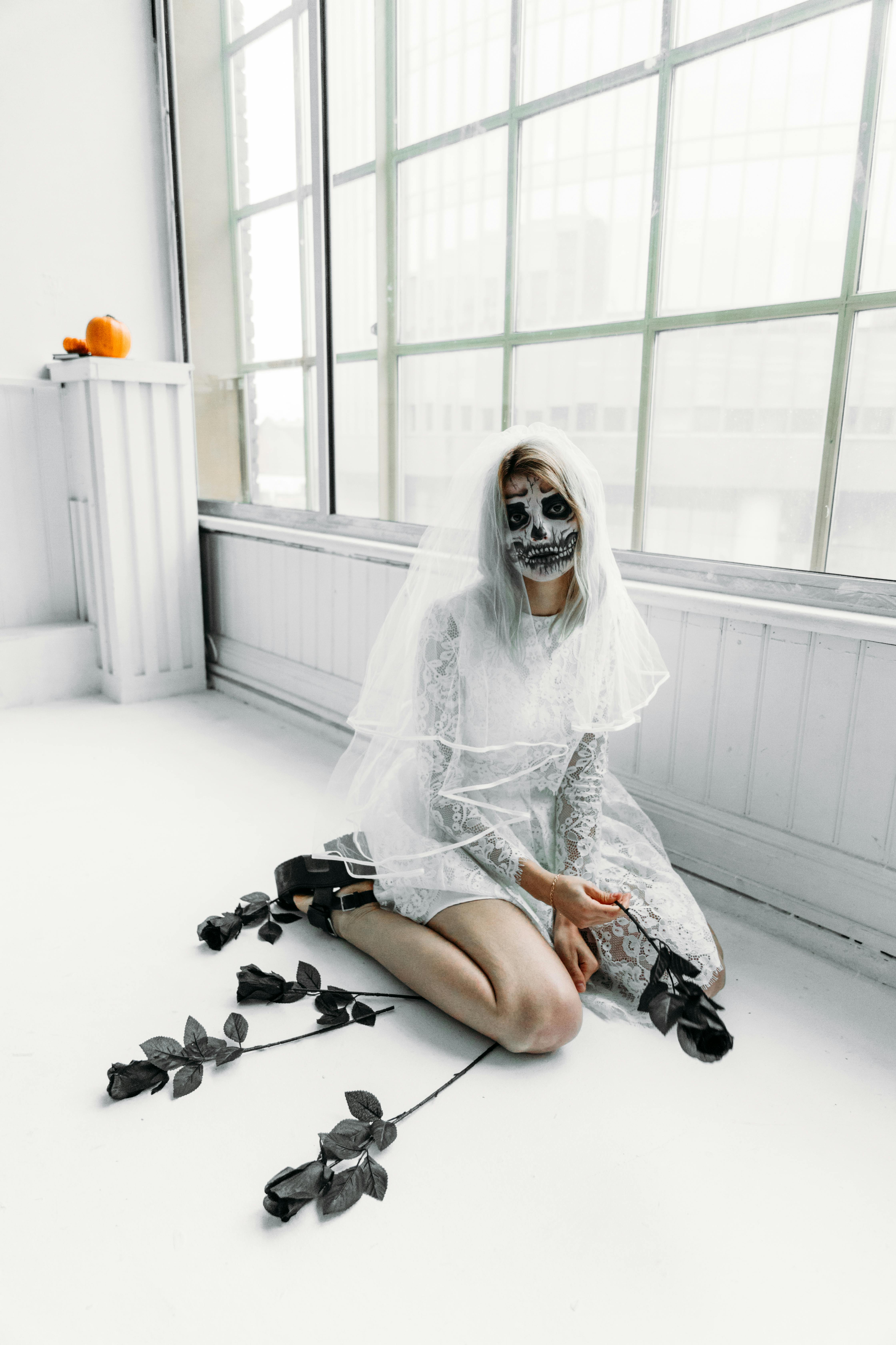 Woman in White Lace Dress Shirt Sitting on The Floor · Free Stock Photo