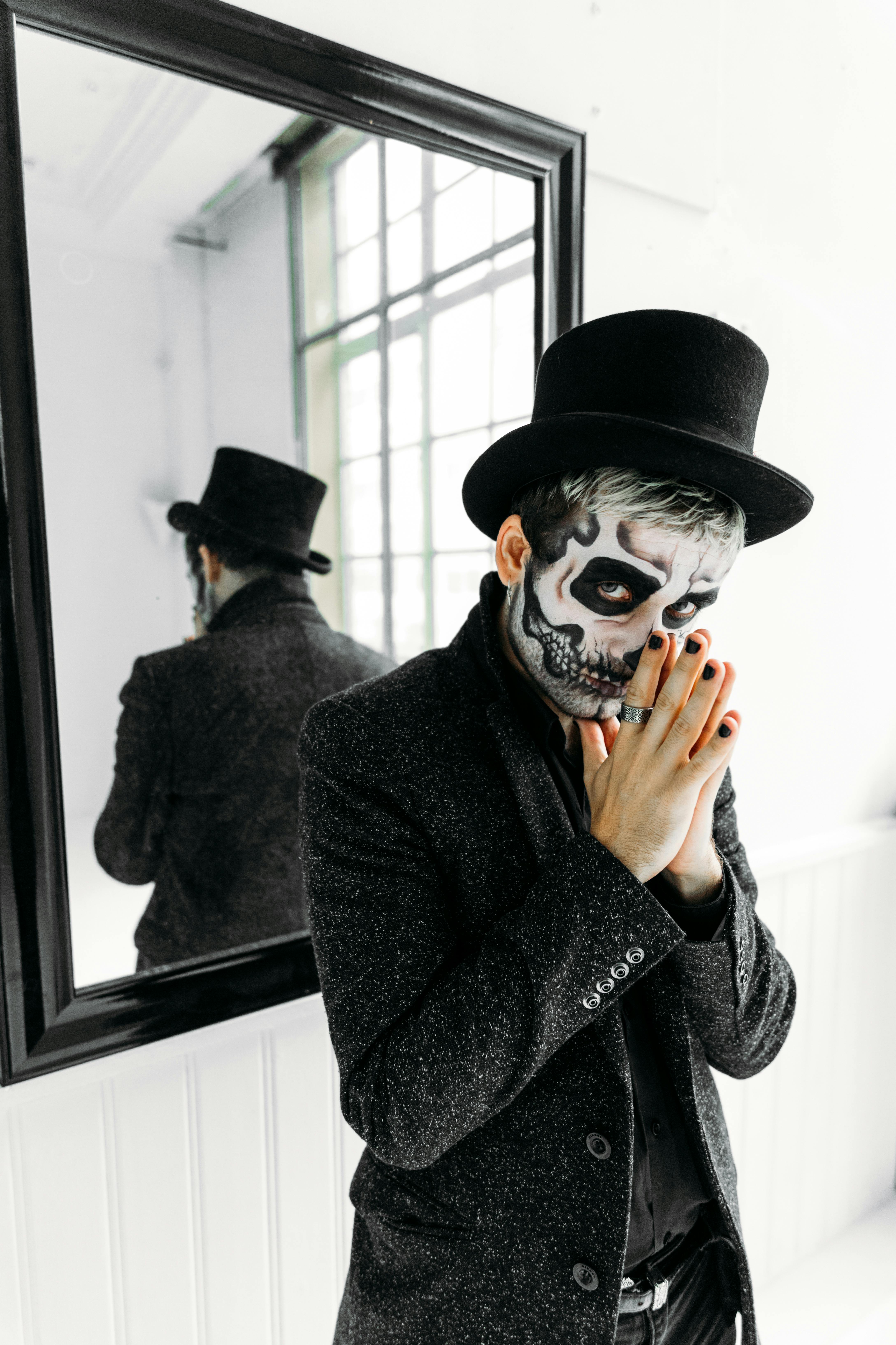 Man in Black Coat with Face Paint · Free Stock Photo
