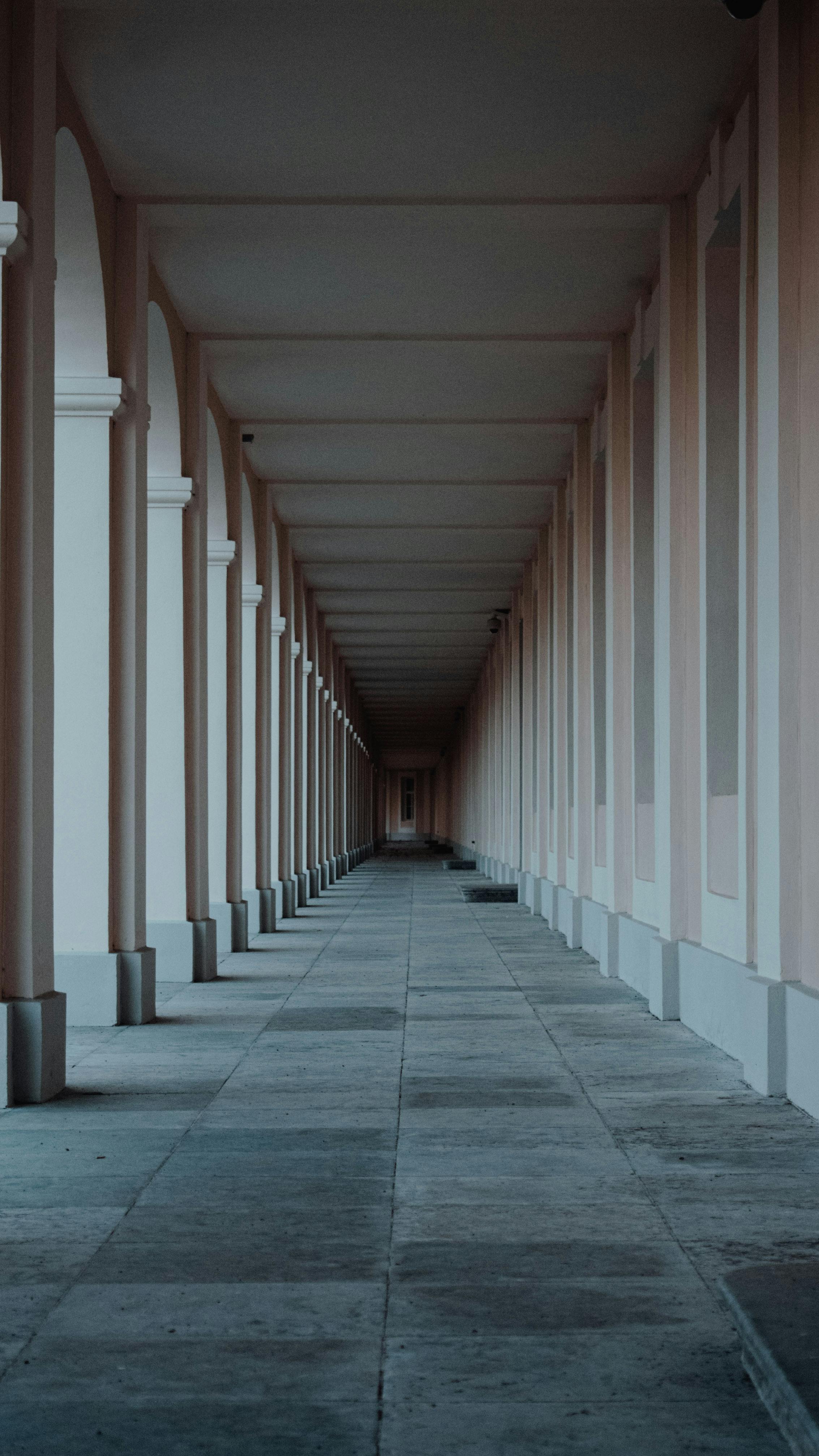 Photo of Hallway of Brown Stone Columns · Free Stock Photo