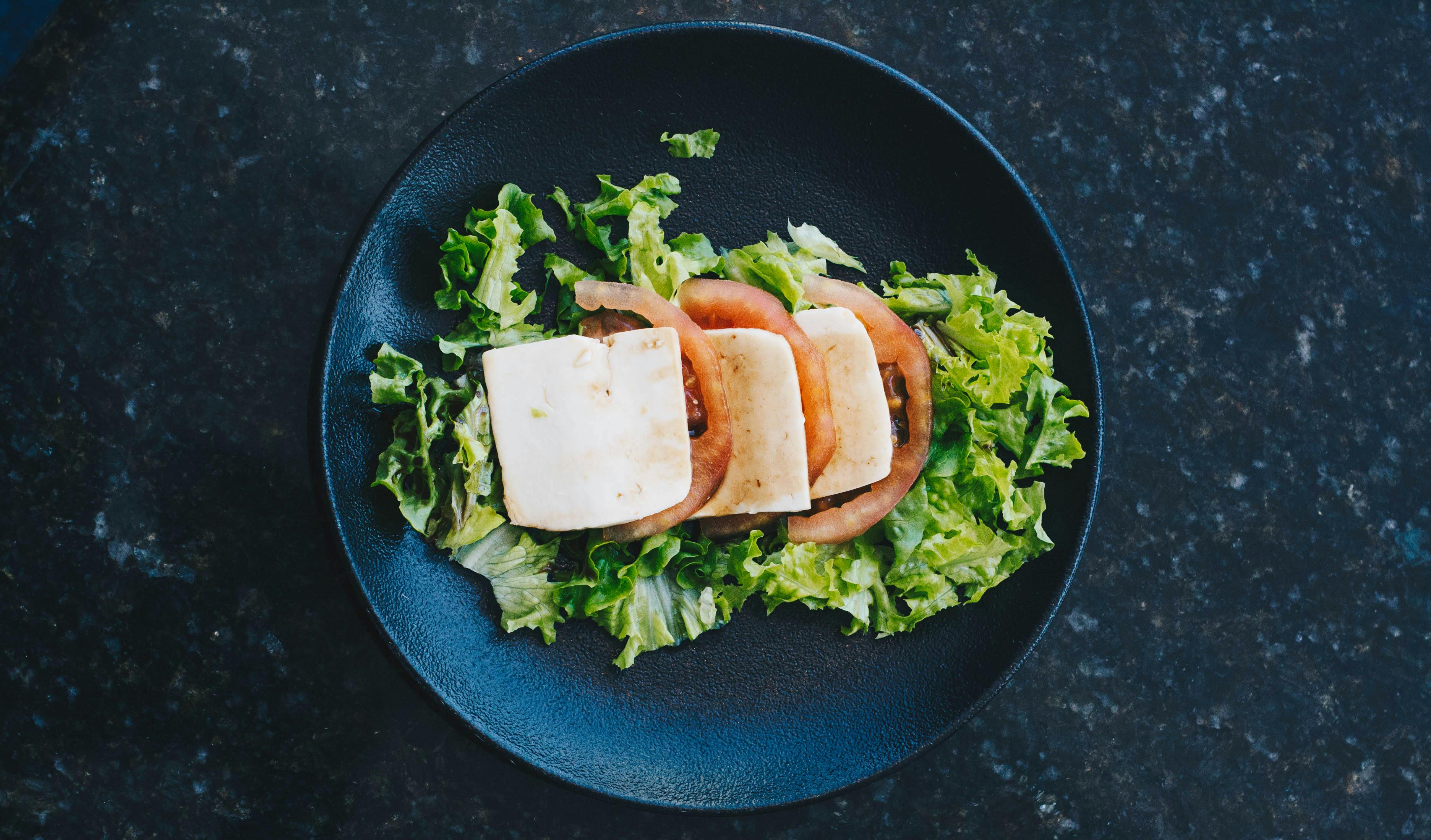 Photograph of a Plate with Cheese and Lettuce · Free Stock Photo