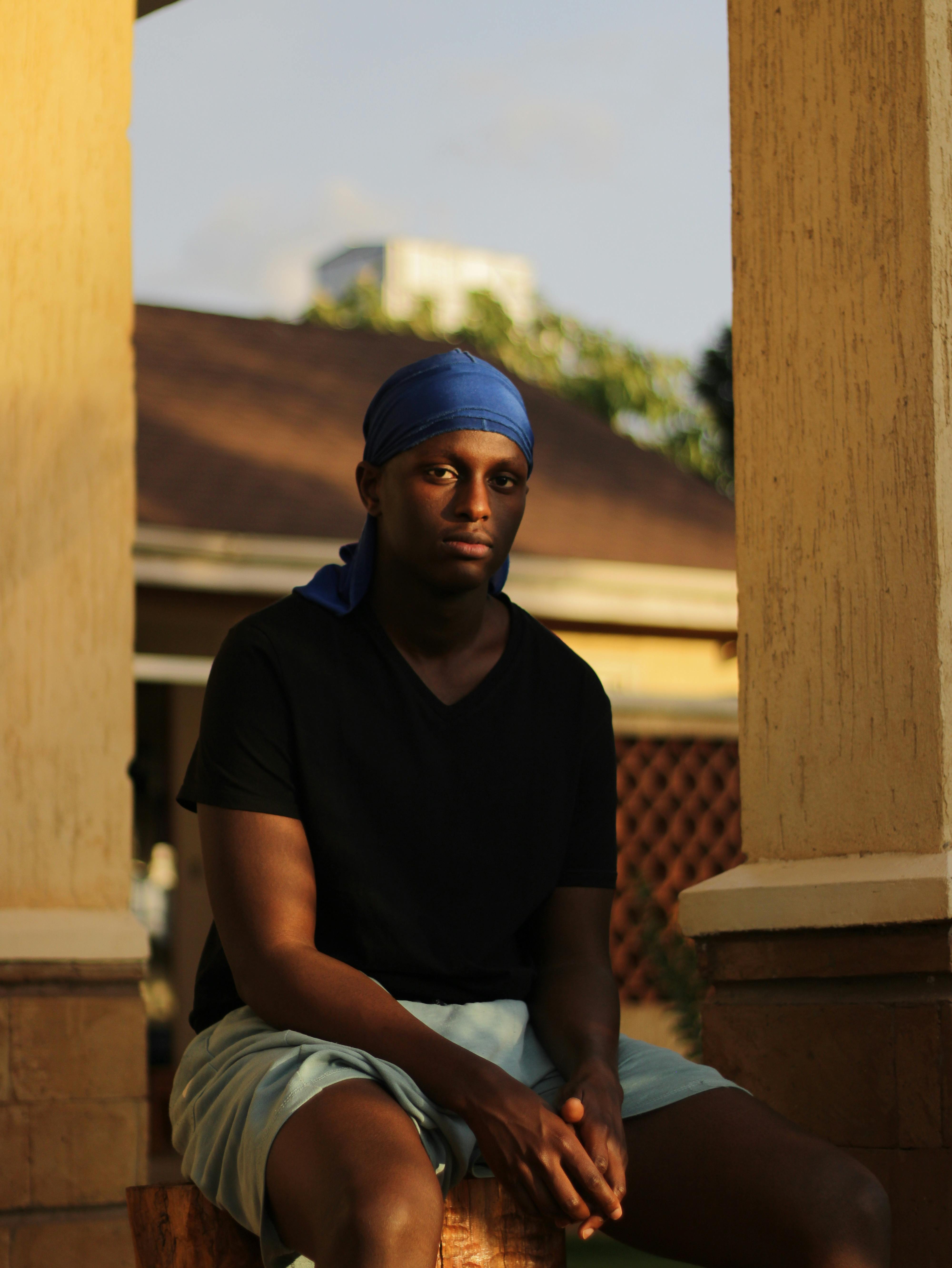 A Man Holding a Sliced Grapefruit · Free Stock Photo