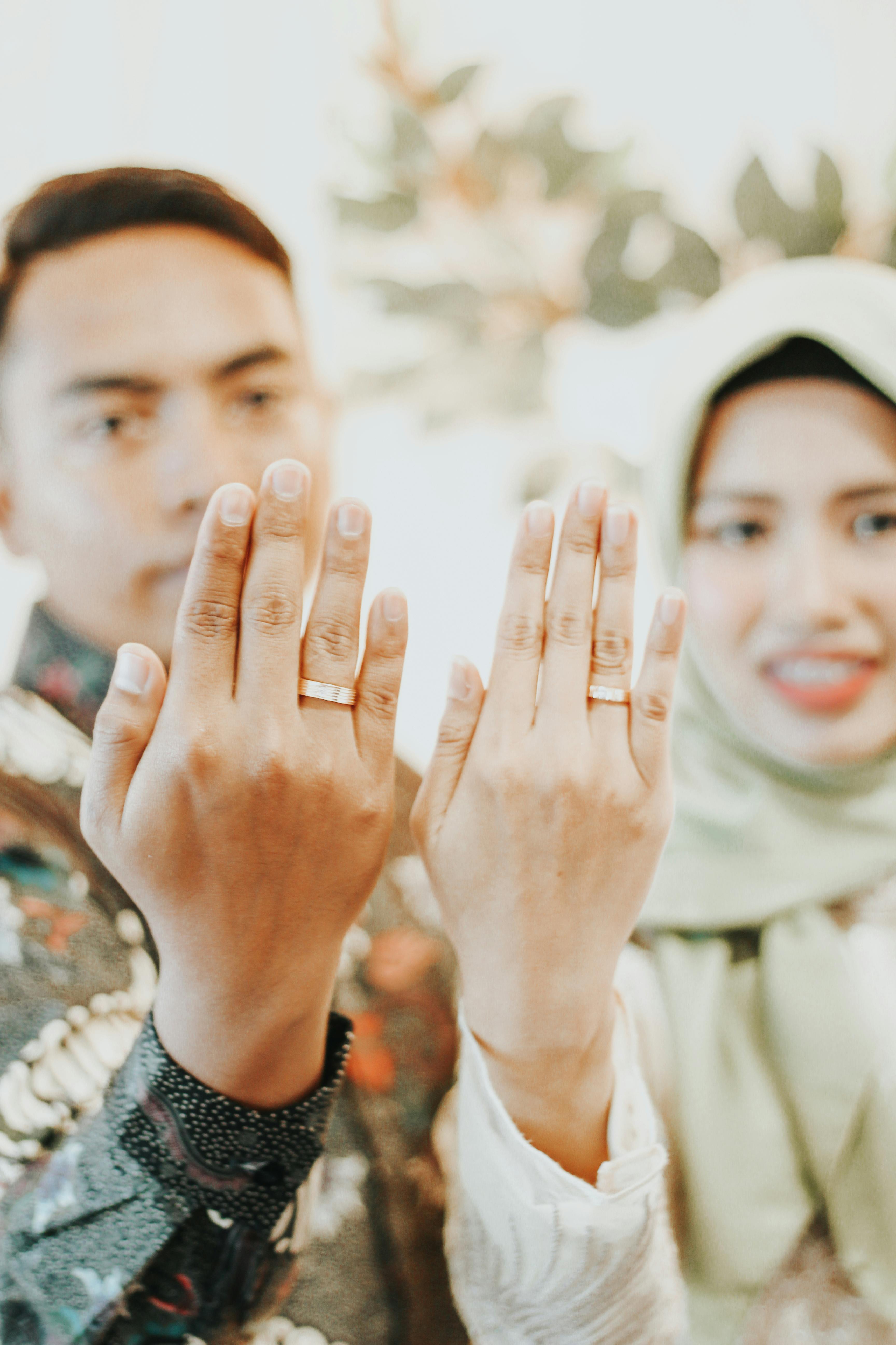 A Couple Wearing Wedding Rings · Free Stock Photo