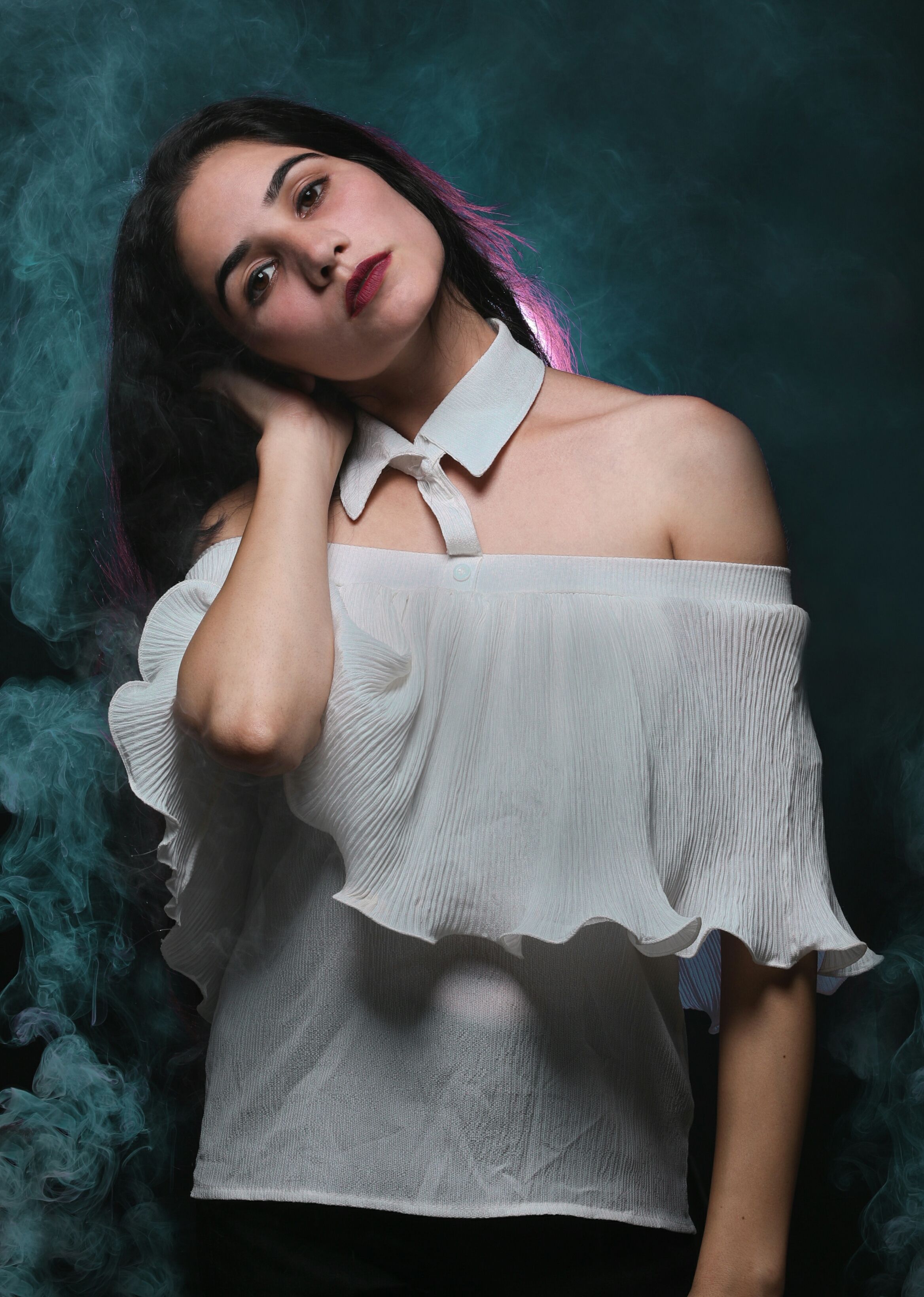 Young female model in unusual dress in studio · Free Stock Photo