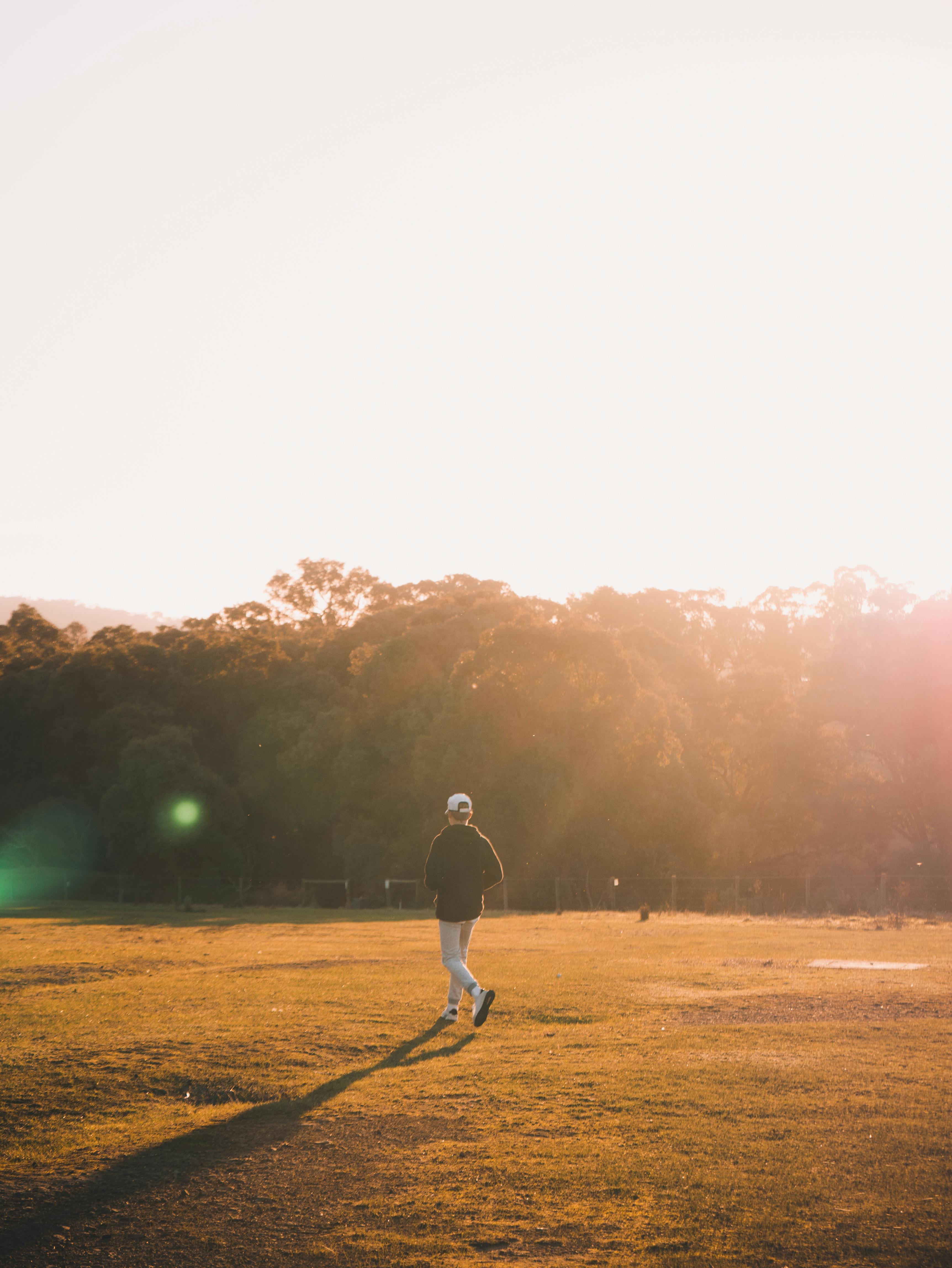 Man Walking during Sunrise · Free Stock Photo